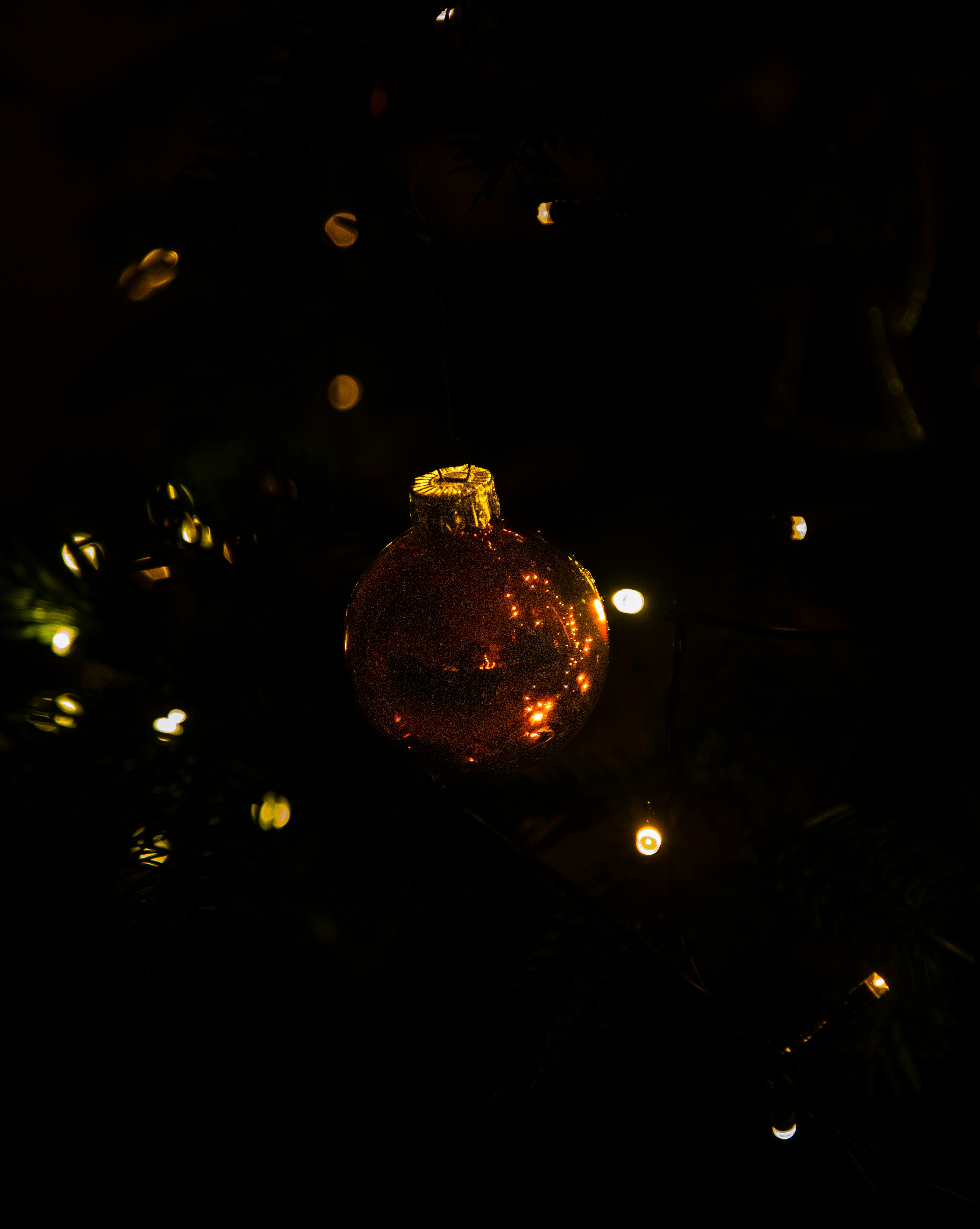 Glowing Glass: A solitary ornament in velvet darkness