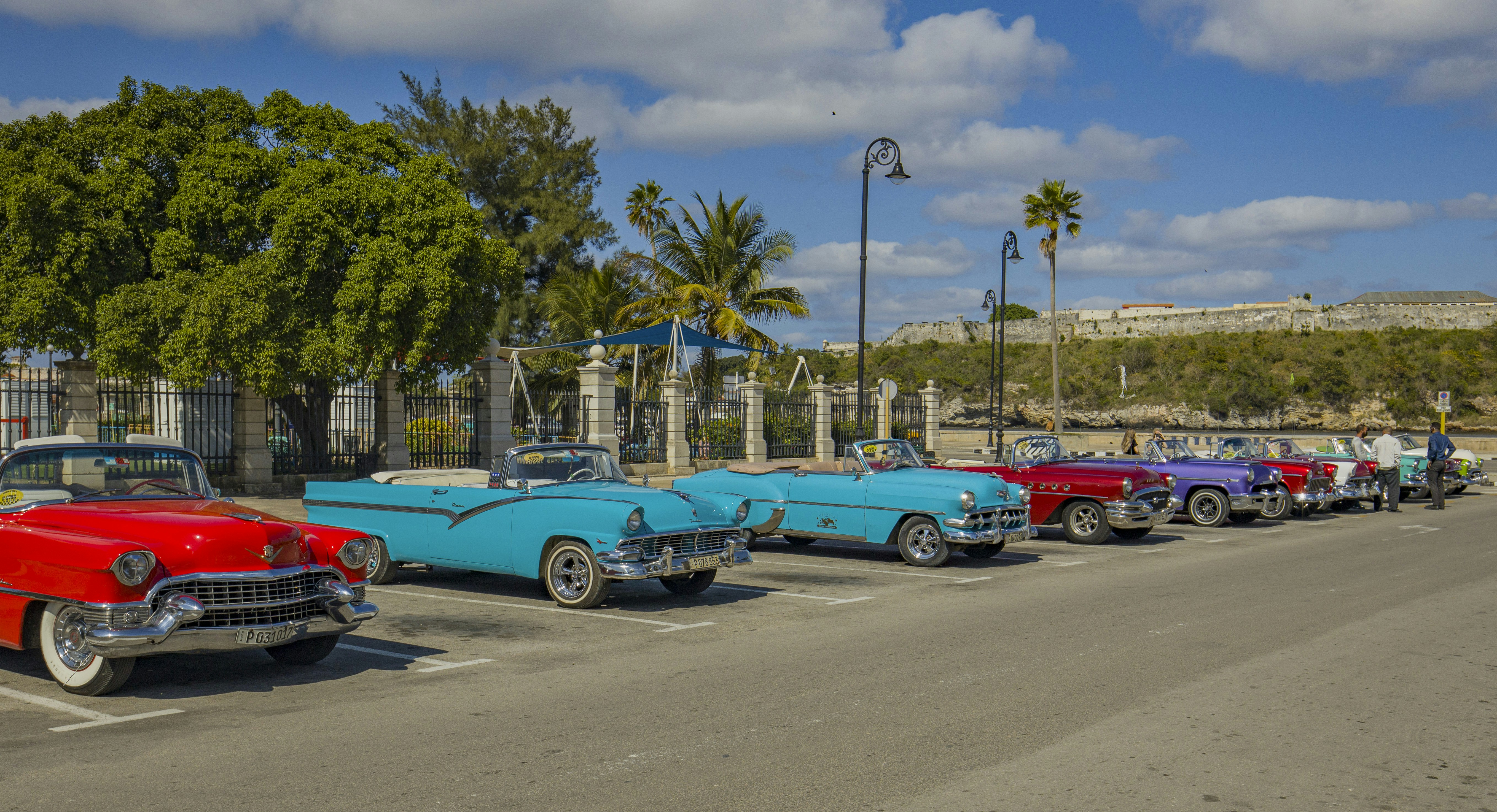 Chrome and Sunset: Classic Cars Line the Coastal Street