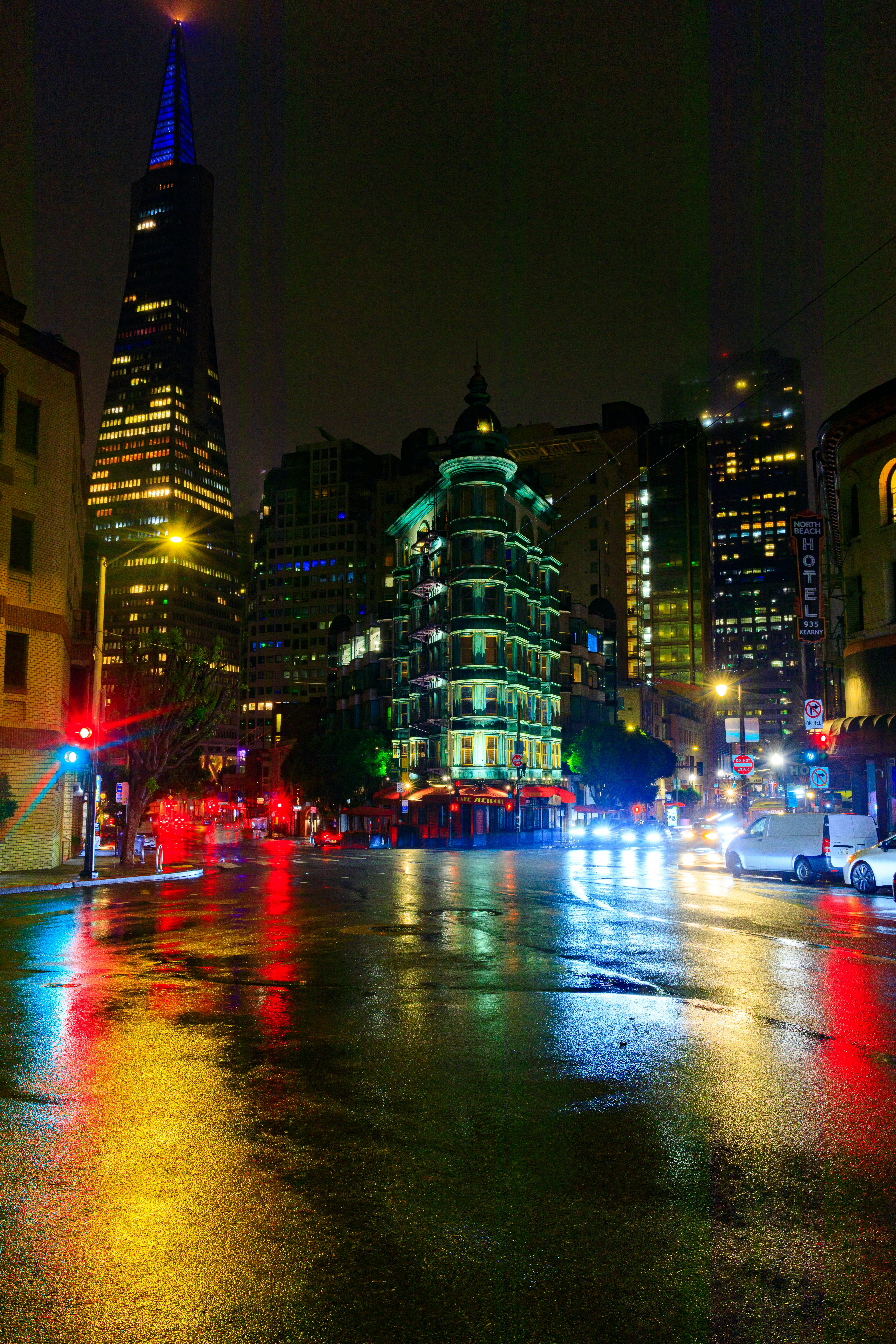 Neon Crescent: A Nighttime Street Under the Spire