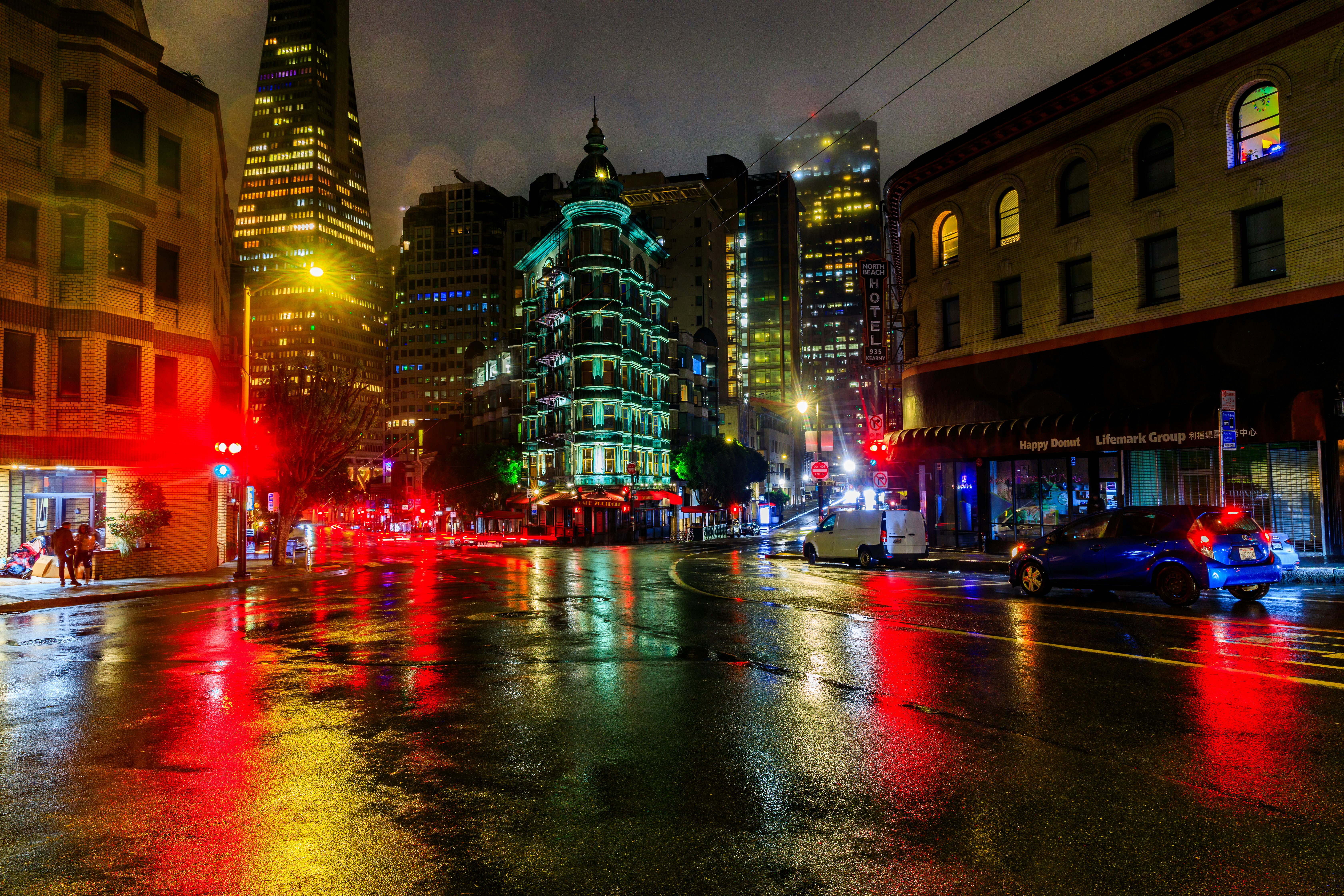 Neon Reflections: A Rain-Slicked City Crossing