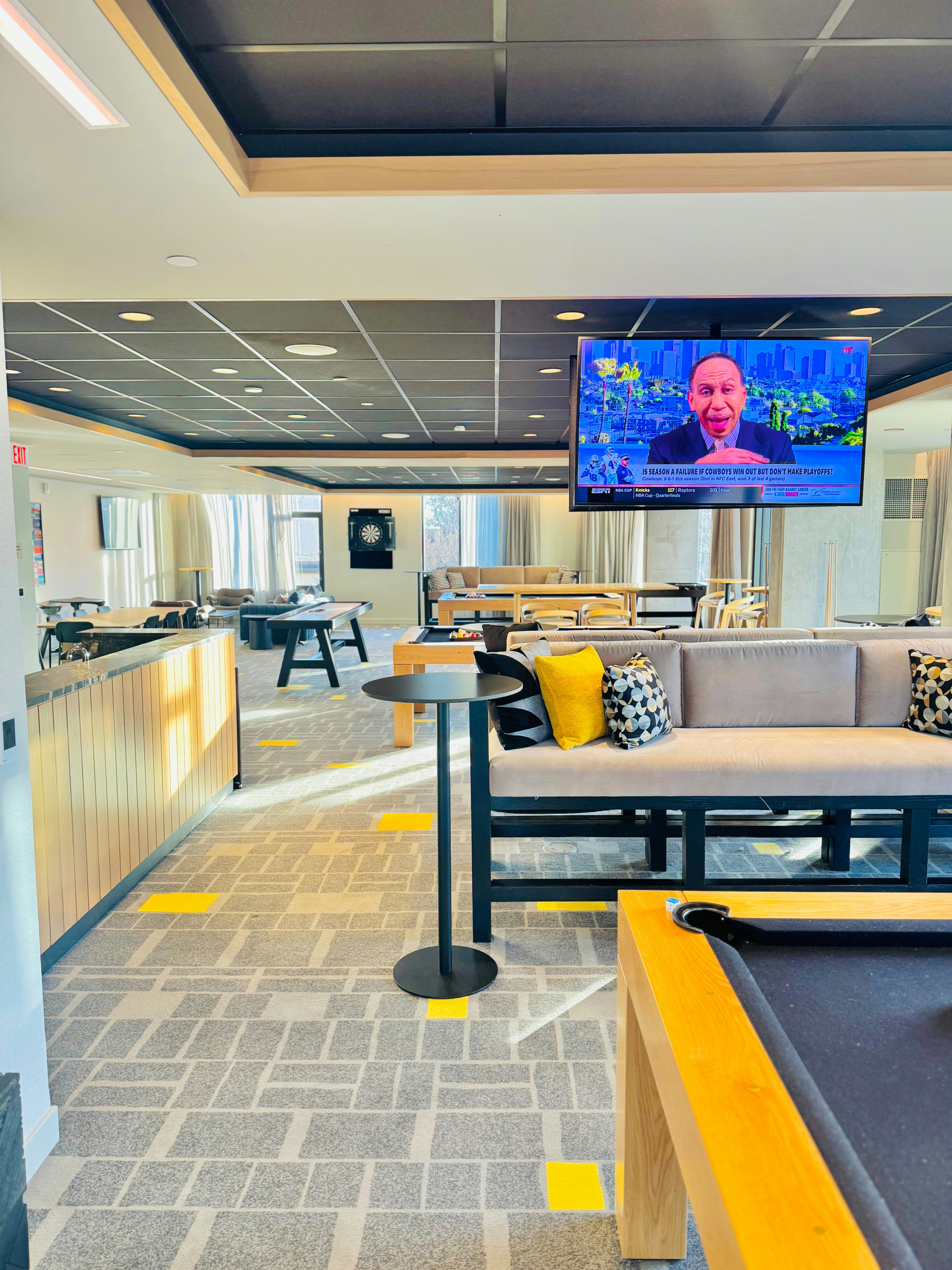 Lounge Core: TV Spotlight over a Quiet Hotel Lounge
