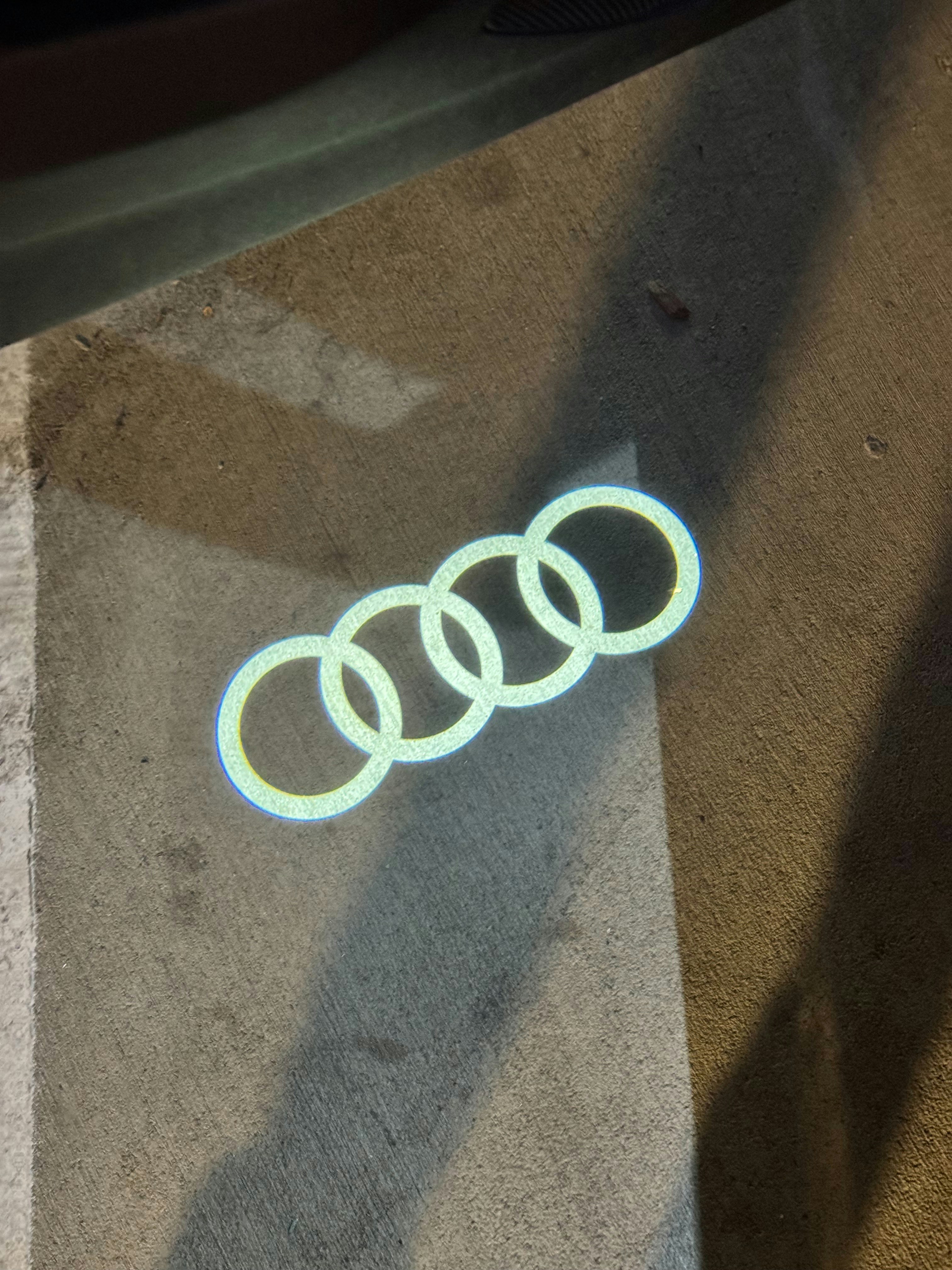 Glowing Audi Rings Cast in Concrete Shadow
