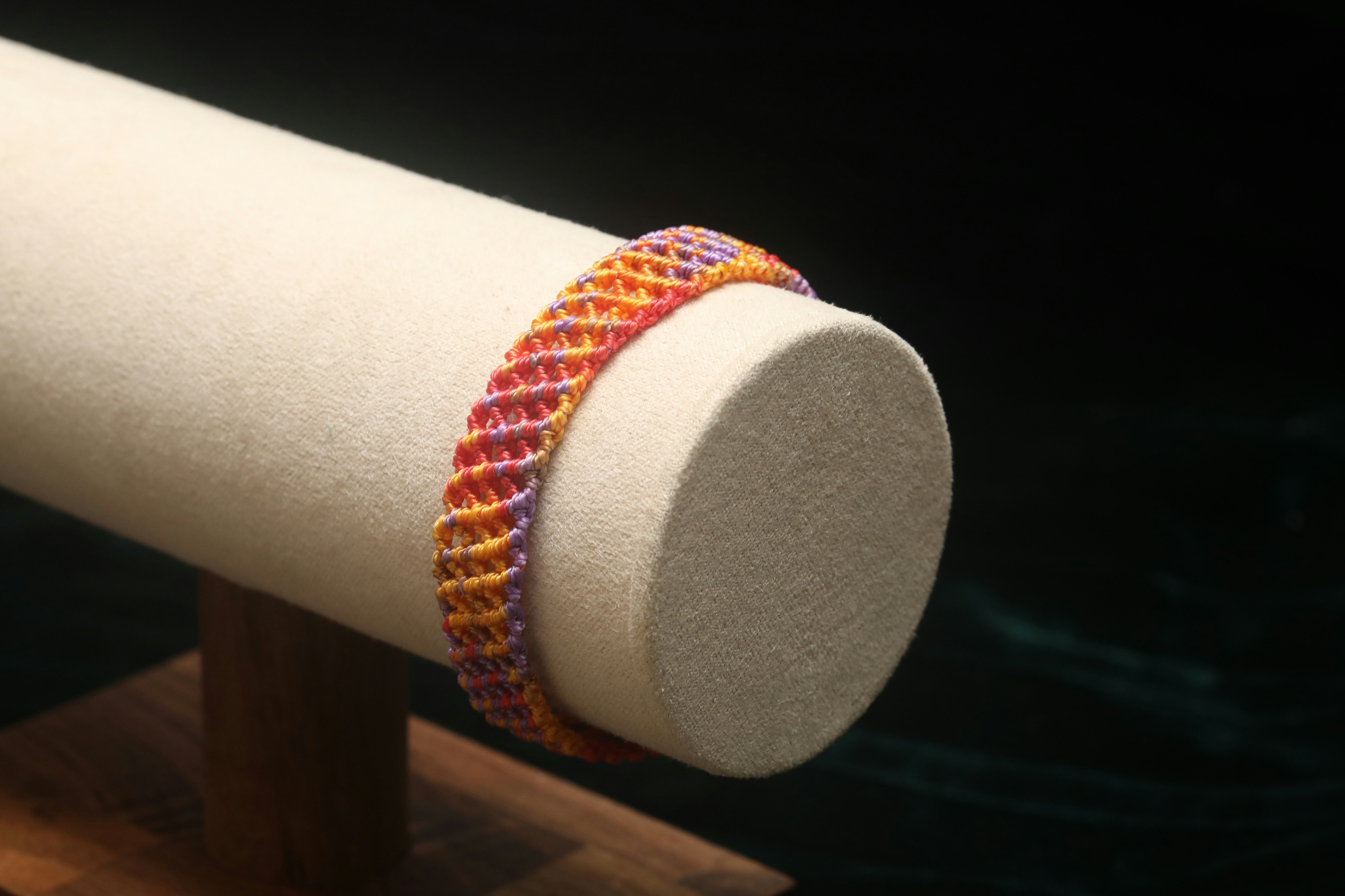 Burnt Orange Weave on a Neutral Cylindrical Stand