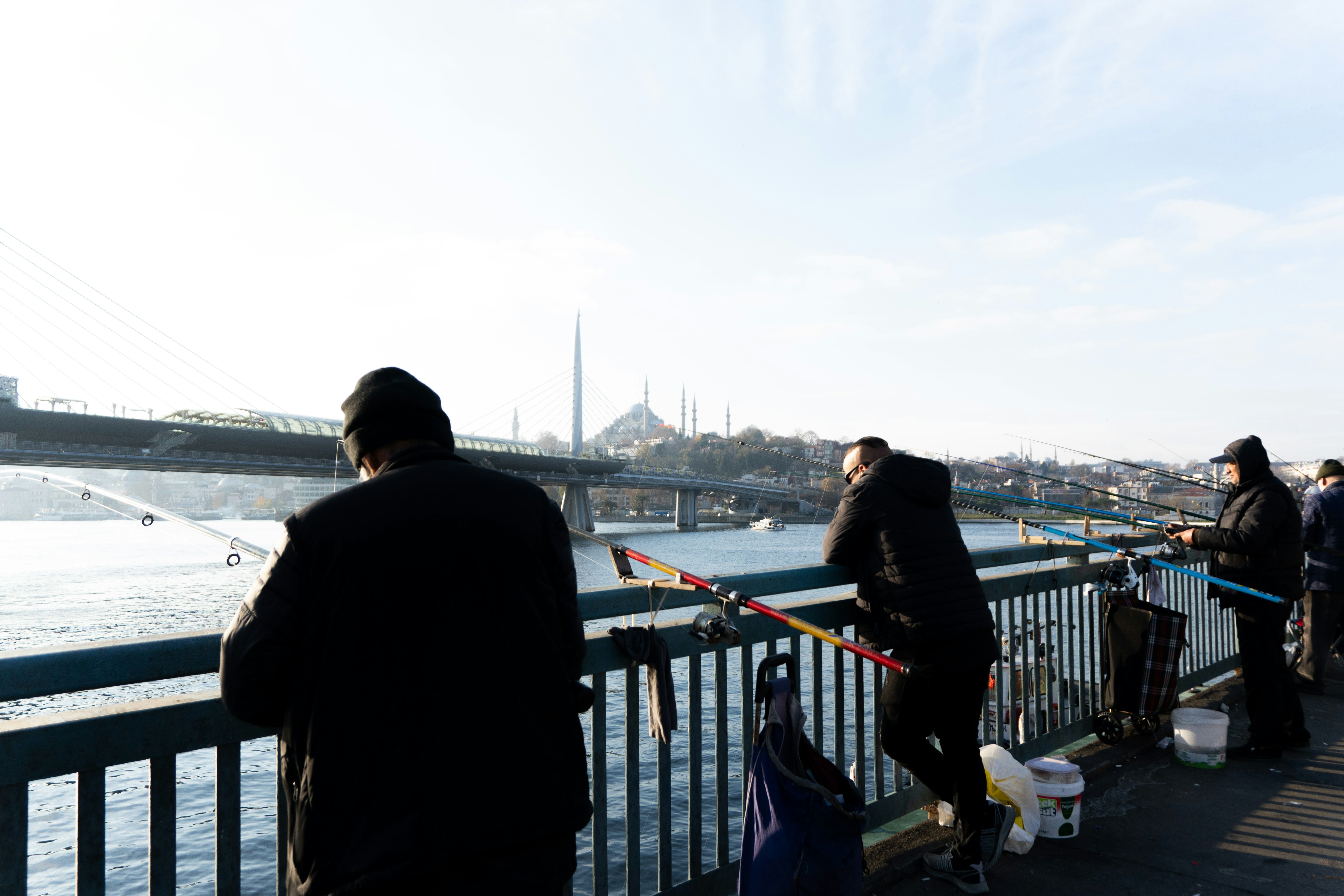 Riverside Anglers: Still Moments and City Glow