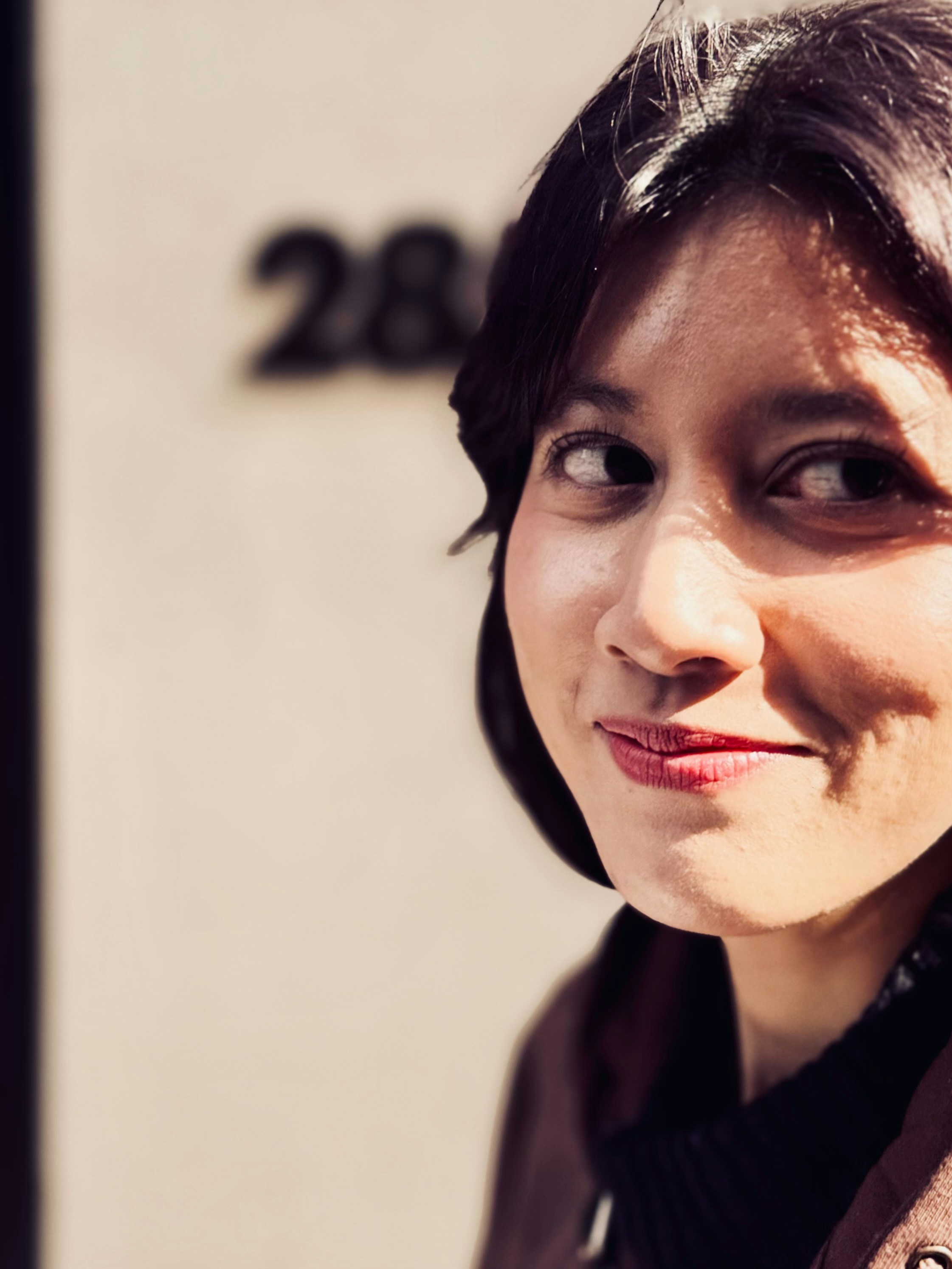 Half-smile, Full Focus: A Portrait with Warm Light and Subtle Mystery