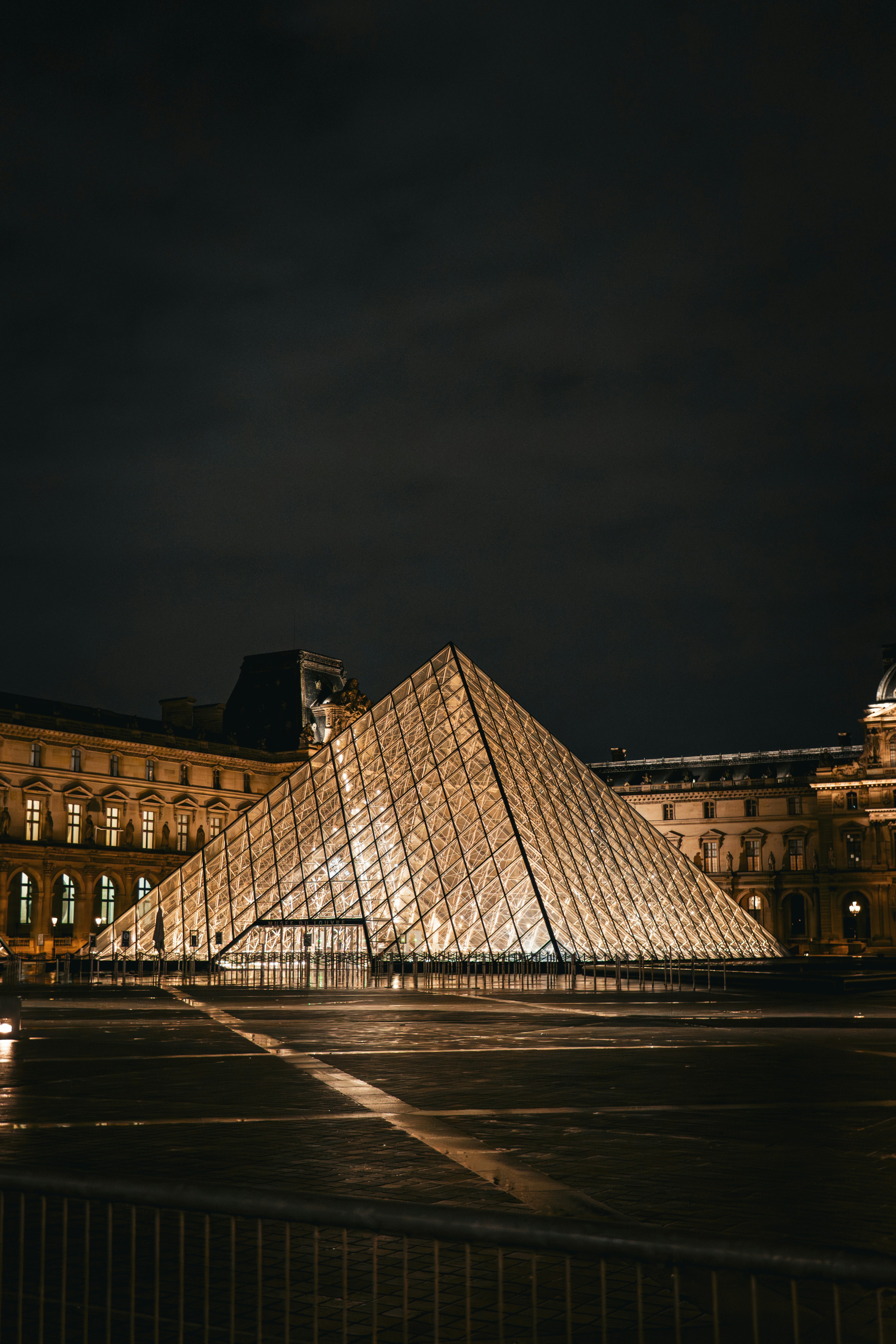 The louvre pyramid illuminated at night in paris. photo – Free Dark ...
