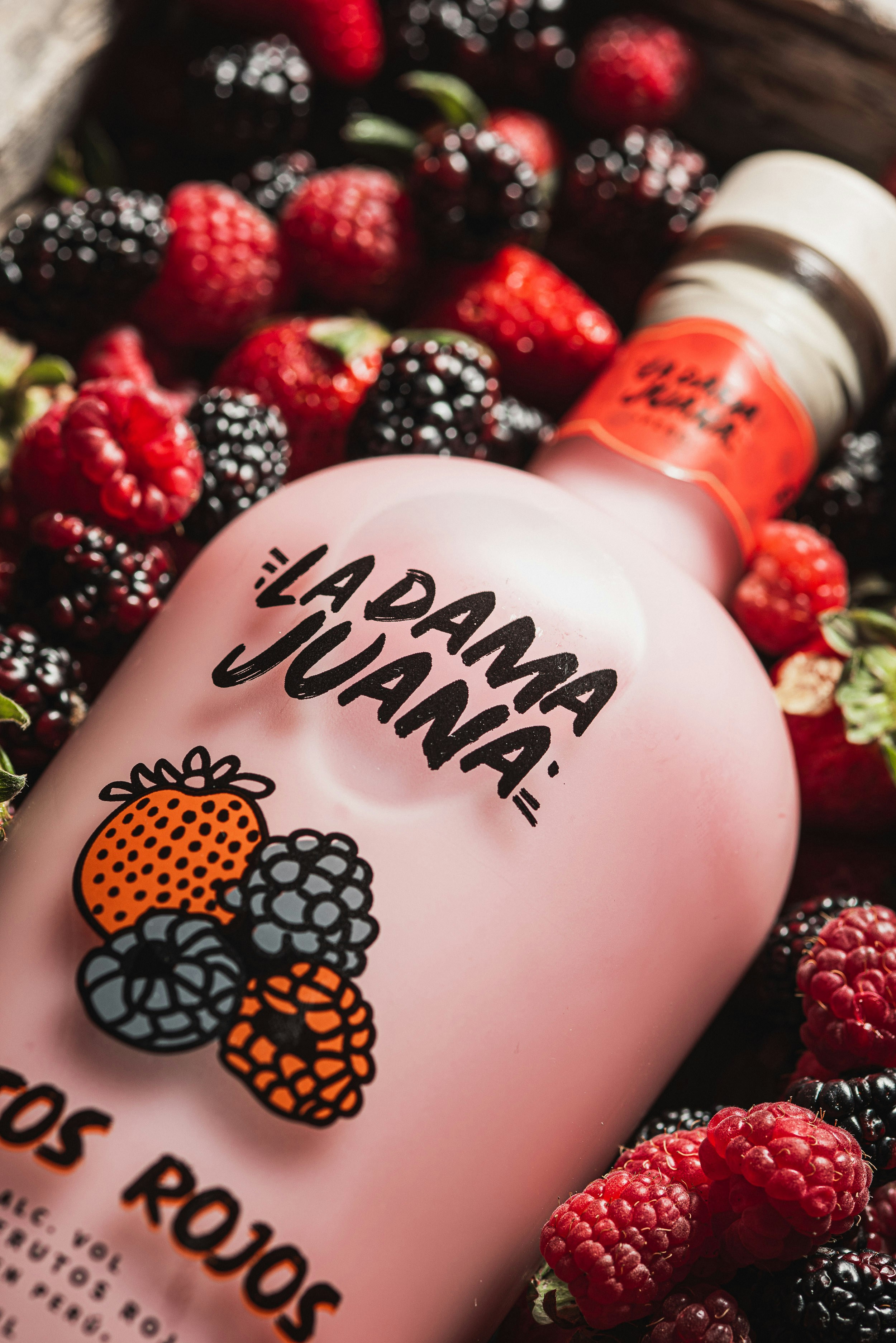 La Danza de Frutos: raspberries, blackberries, and a pink bottle of Li Dan Juan