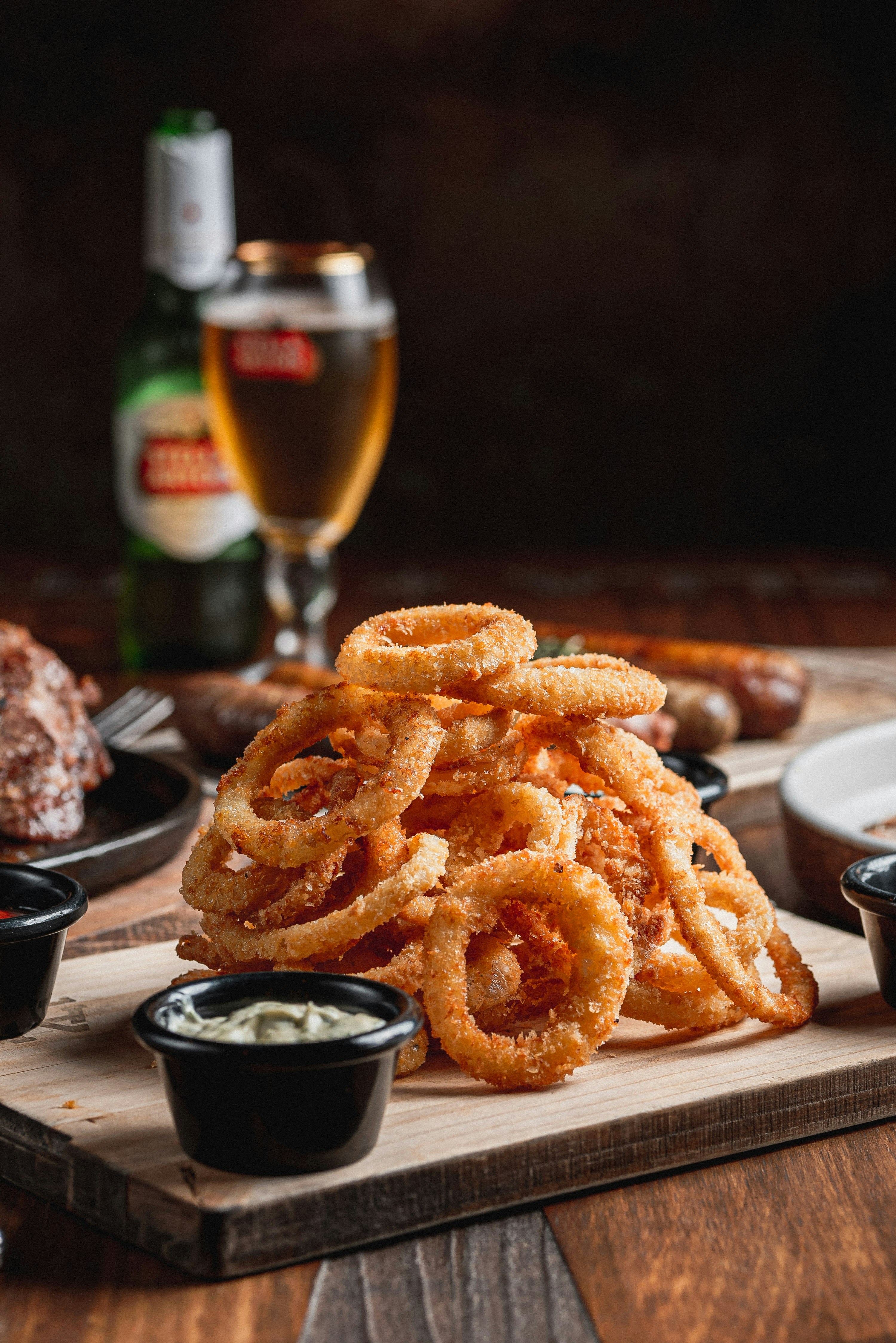 Golden Onion Rings Parade on a Rustic Board