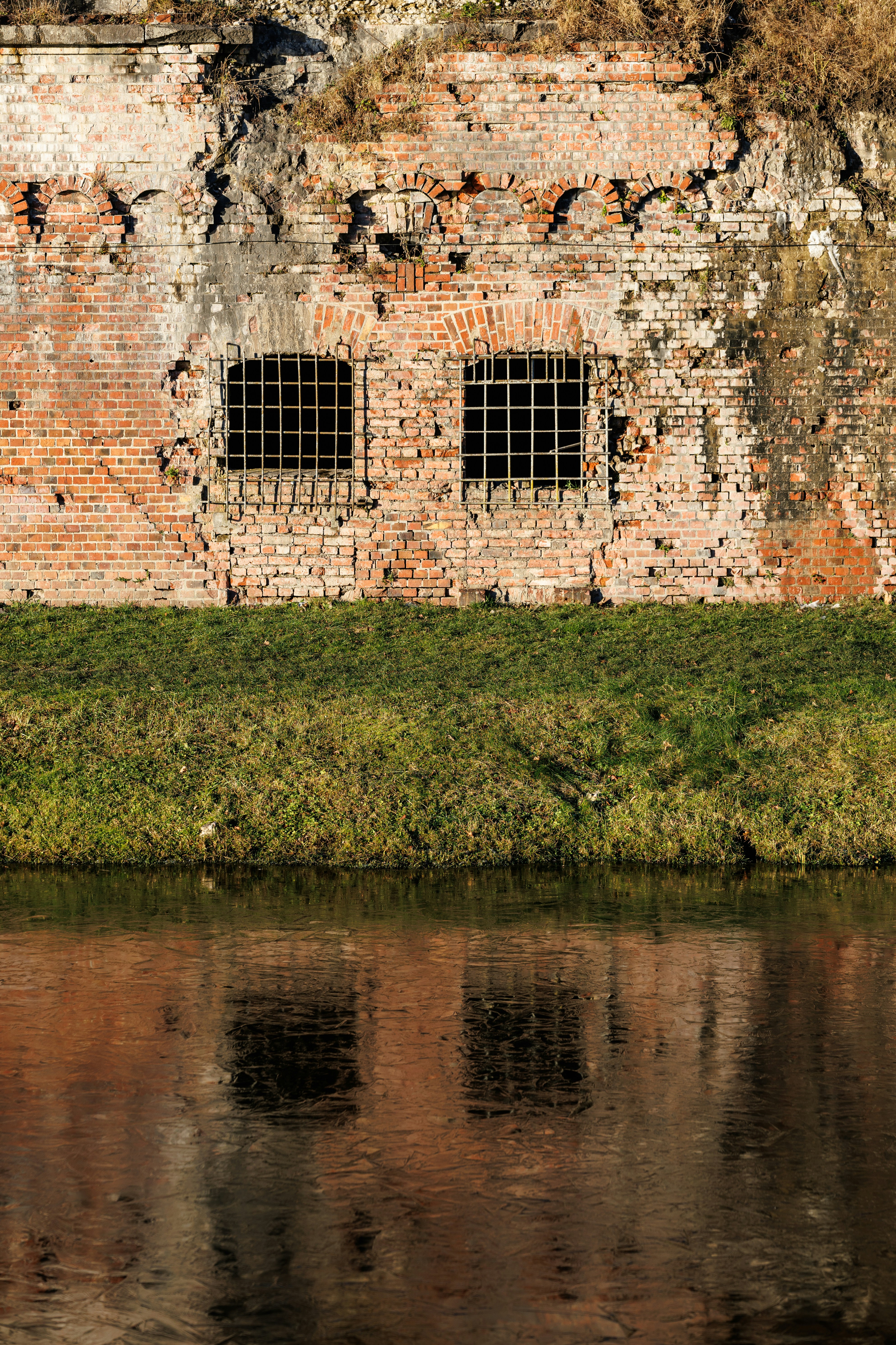 Ruined Brick Wall by the Tarnished Canal