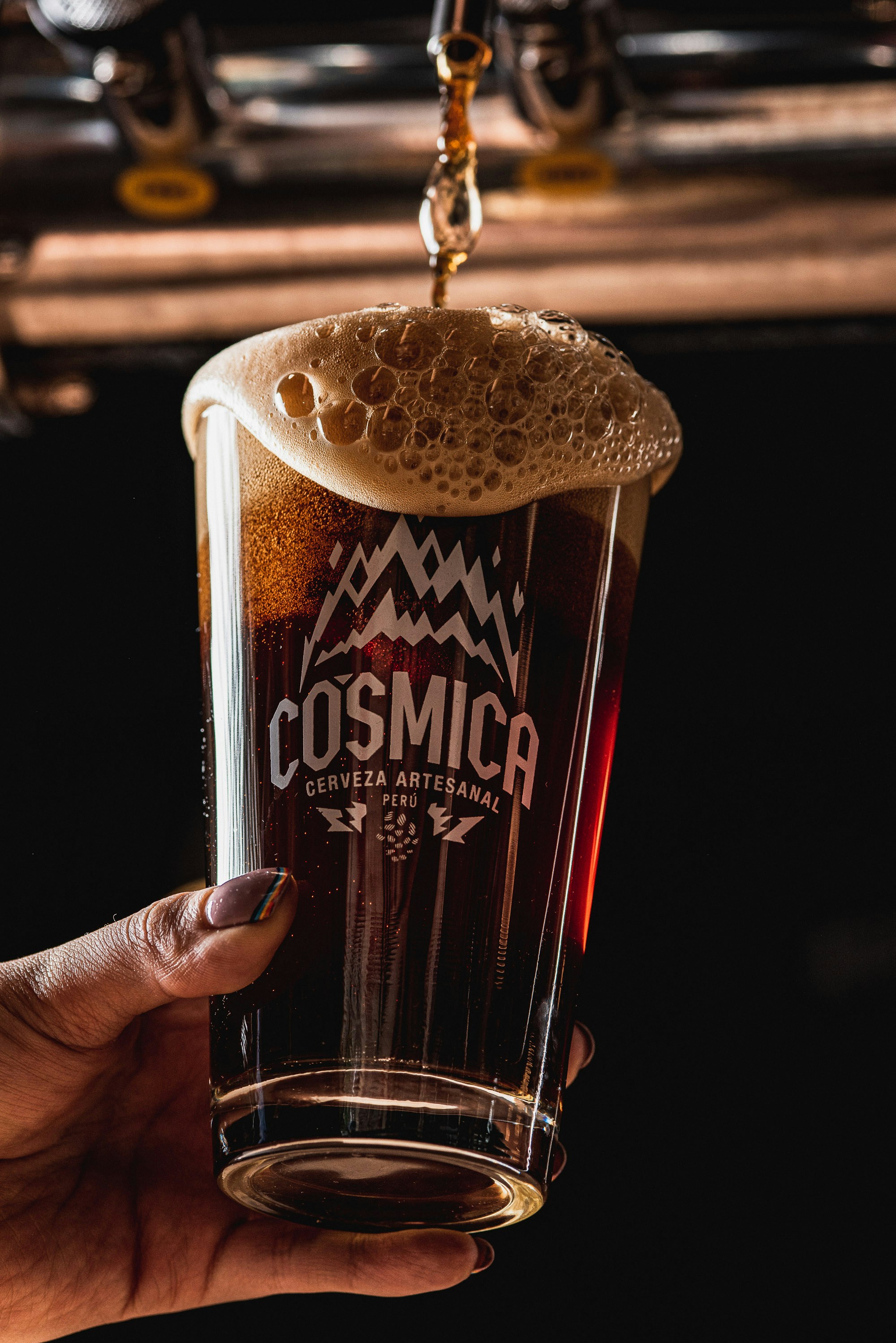 Floating Amber: A Pint Captured in Glass and Foam