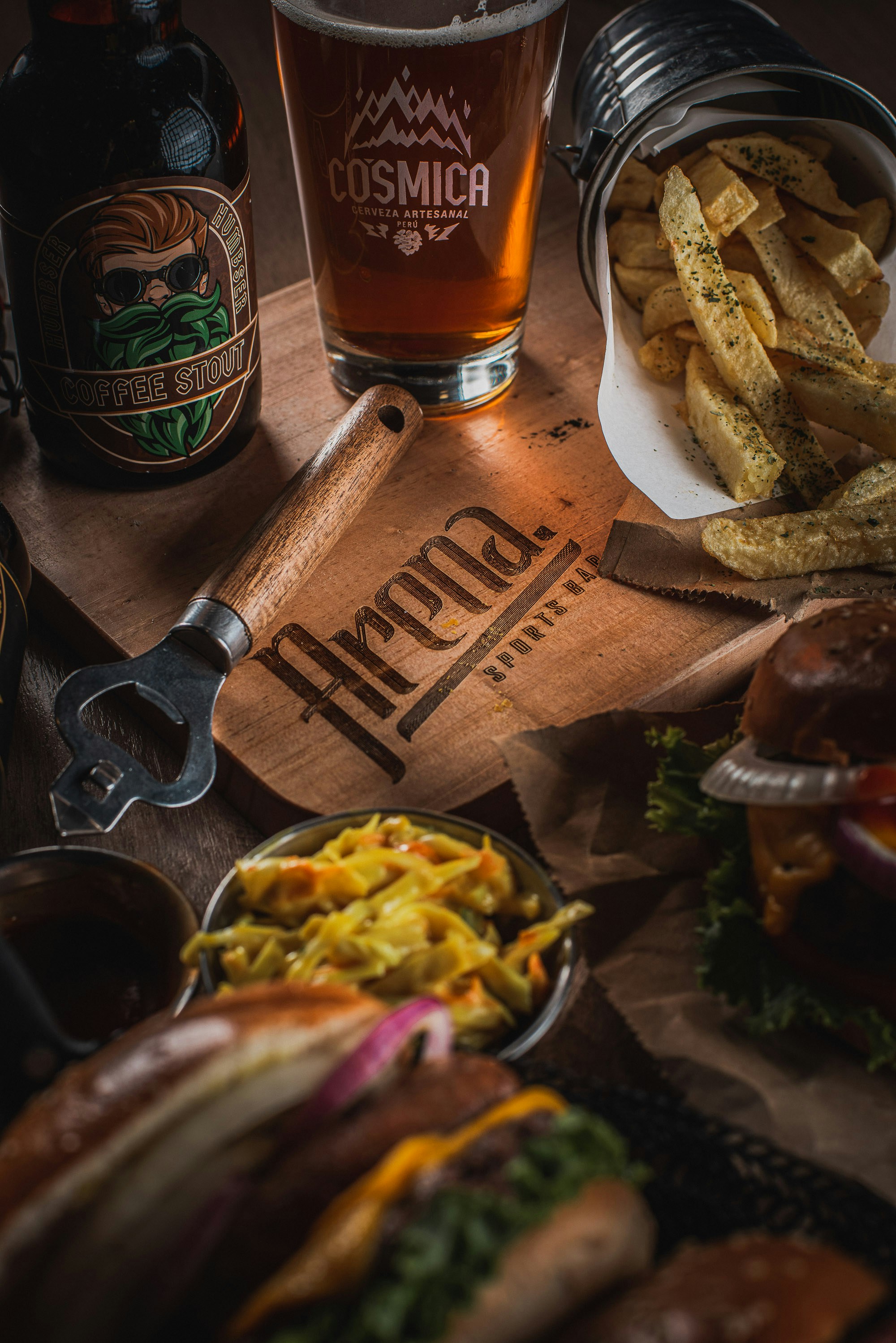 A rustic table of craft and flavor: beer, chips, and a prow of aromas