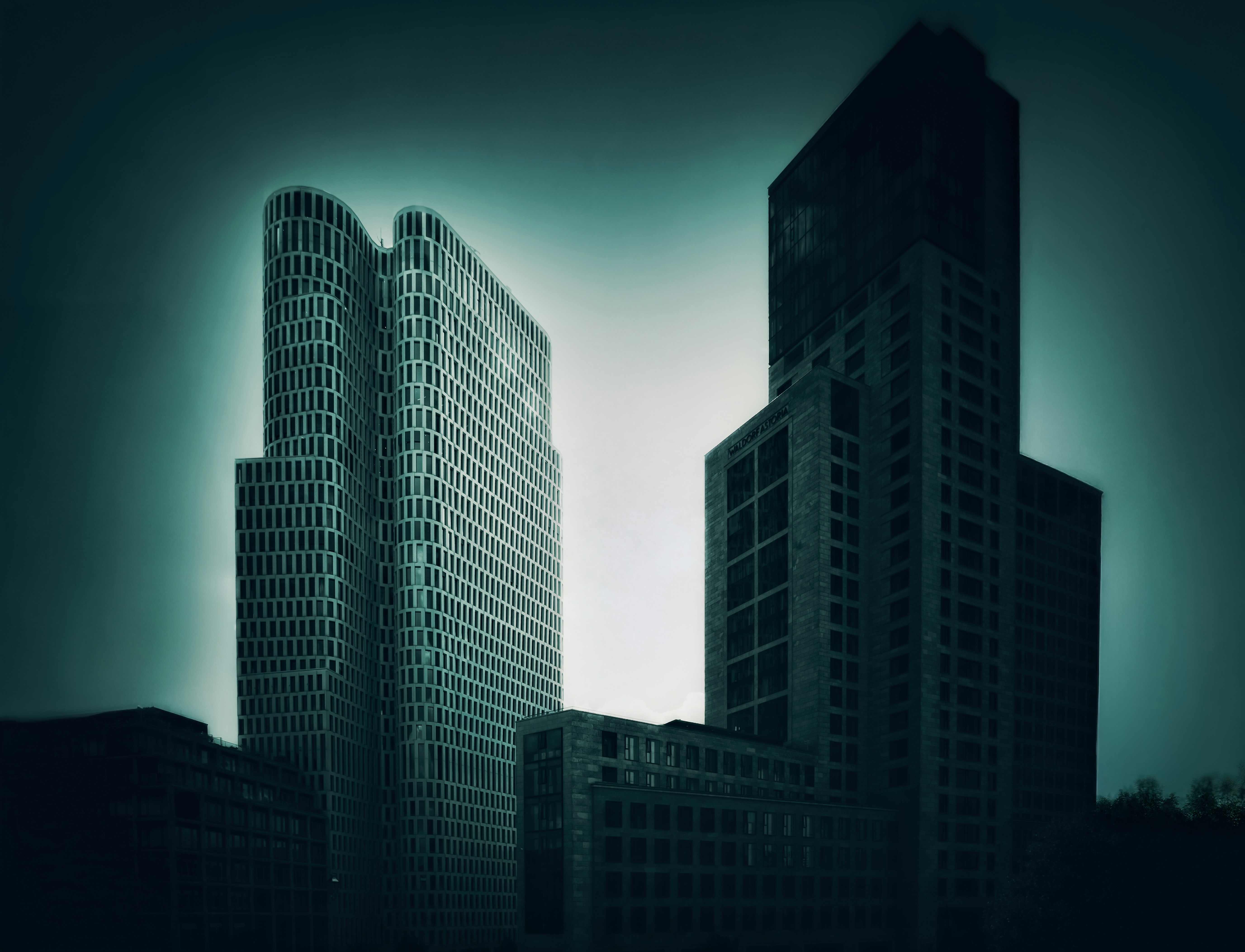 Urban Monoliths: A Dusk Silhouette Over Tall Glass