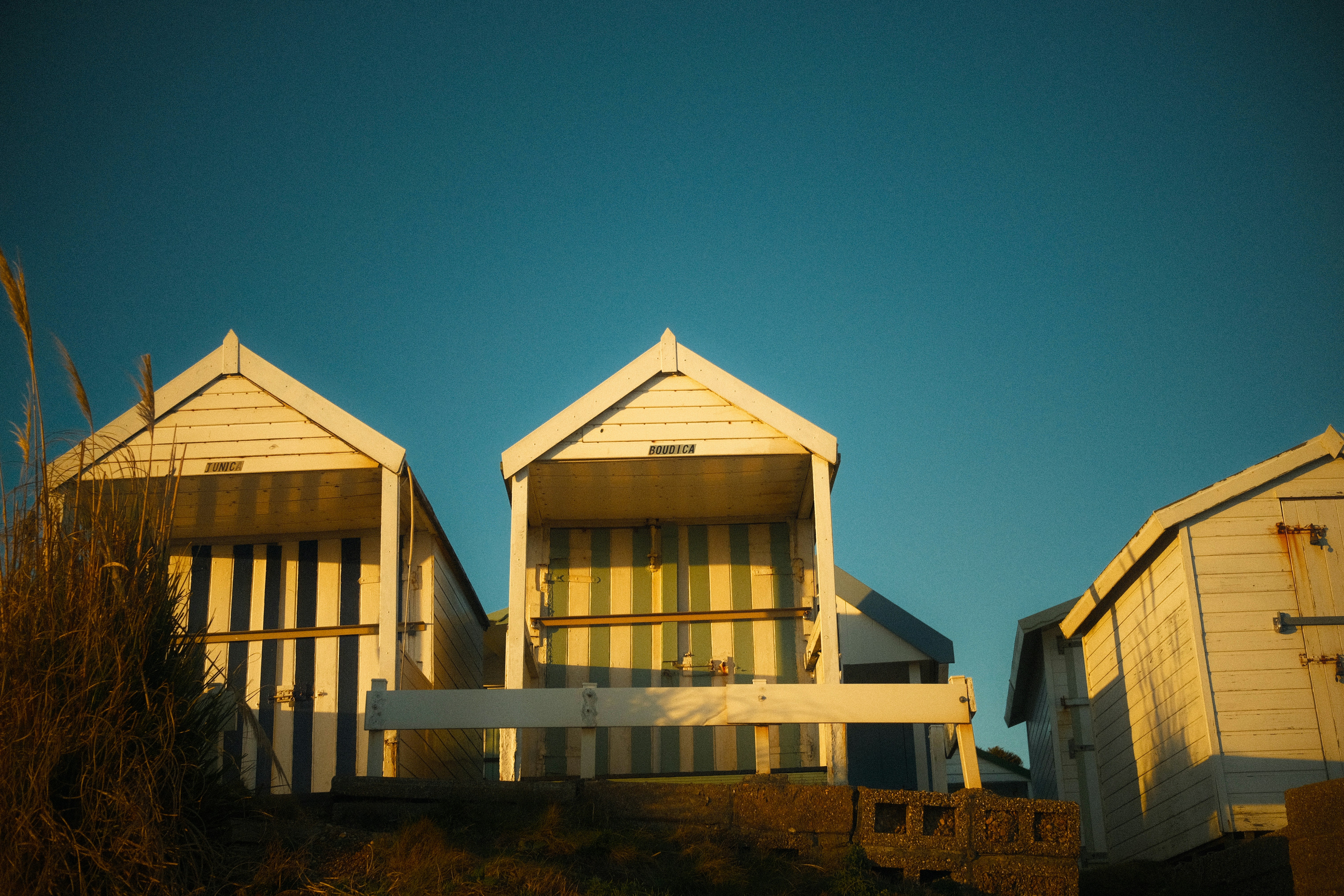 Sunlit Beach Huts at Dusk