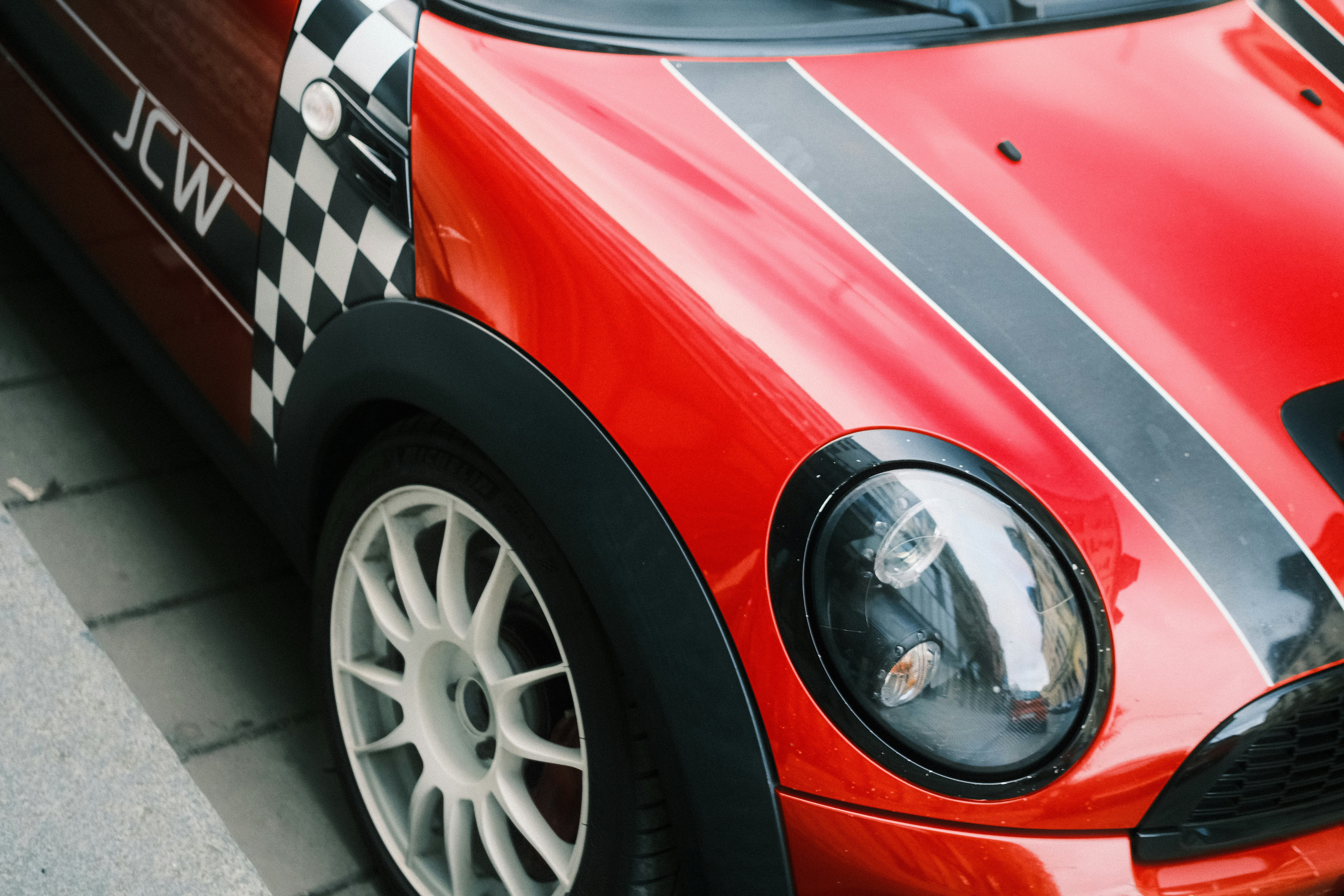 Red mini cooper with racing stripes and checkered flag photo – Free ...