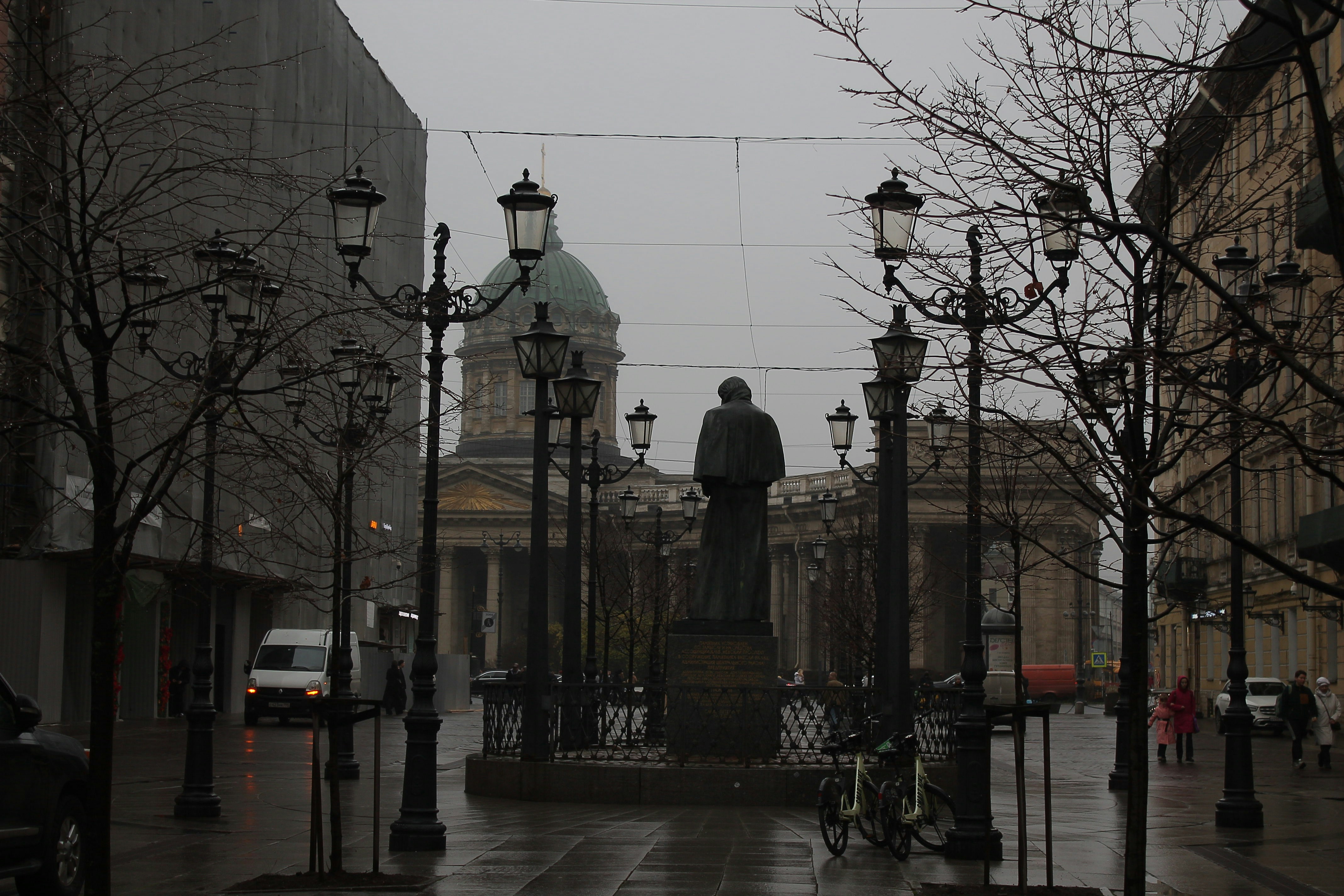 Evening Square: Statue, Street Lamps, and Dome on a Quiet City Maze