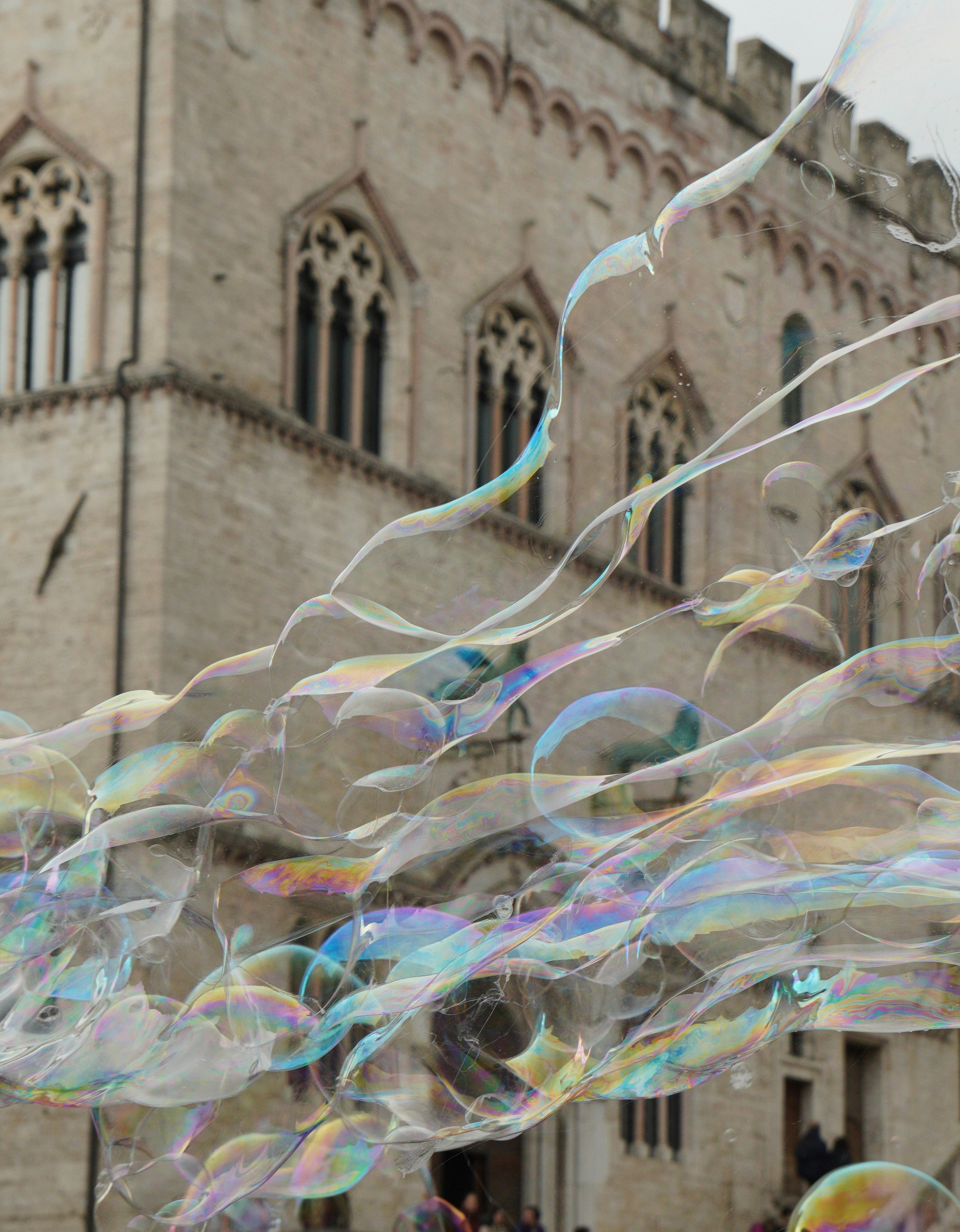 Soap Bubbles Dance Across the Historic Facade