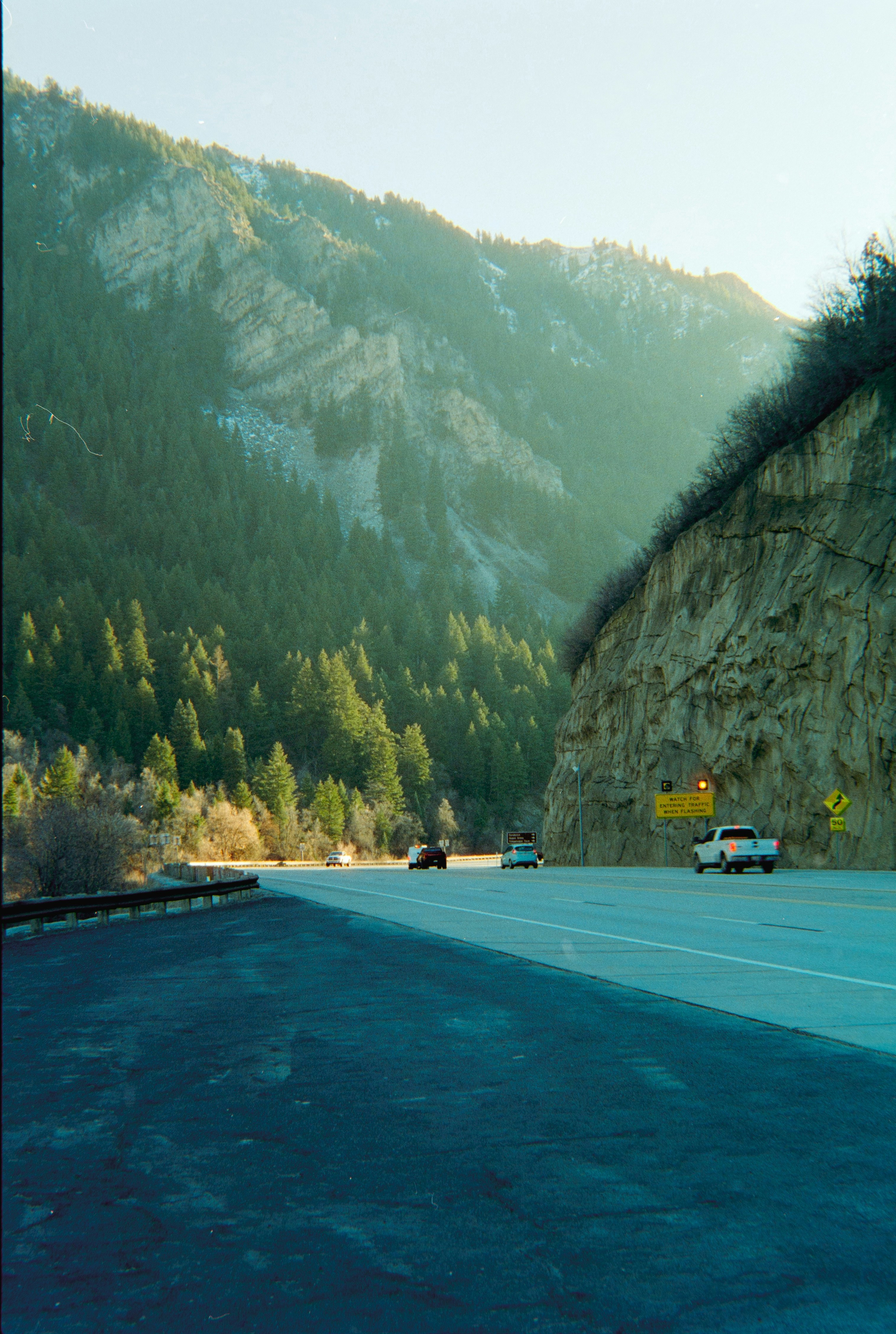 Highway Through the Sierra: Cars Trek Along a Mountain Pass