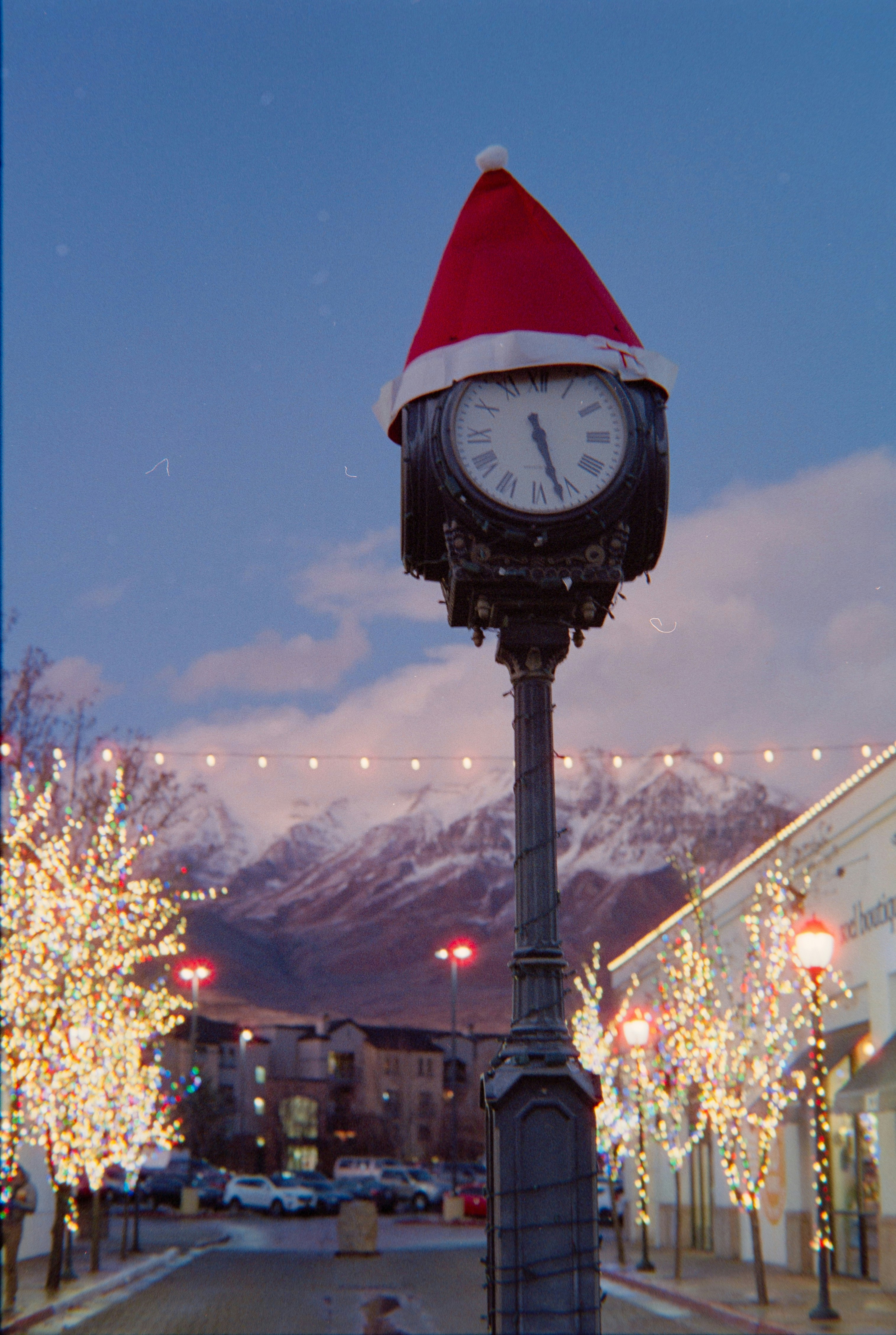 Santa on the Town Clock: Festive Street at Dusk