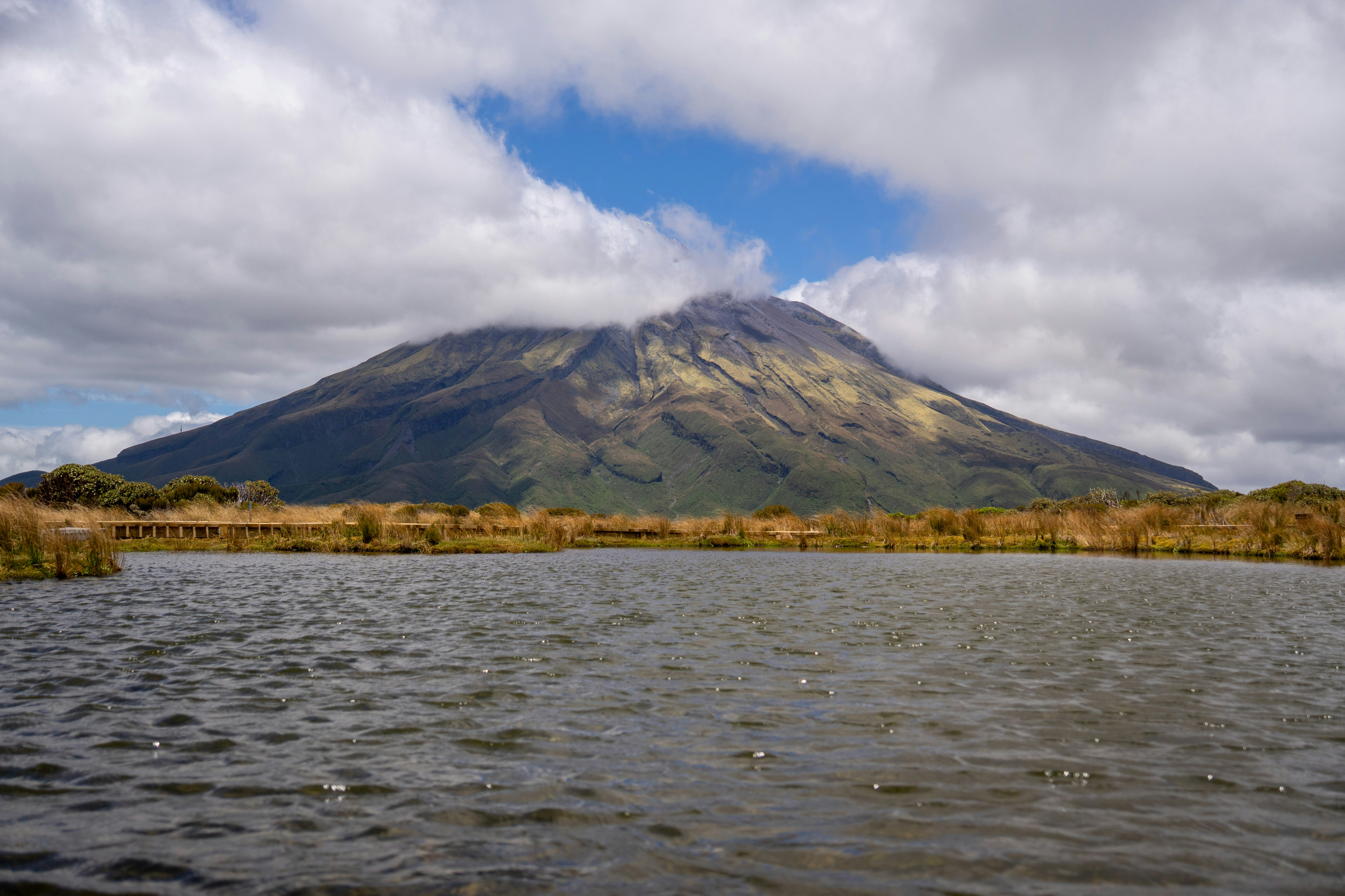 Snowy Peak under a Patchwork Sky