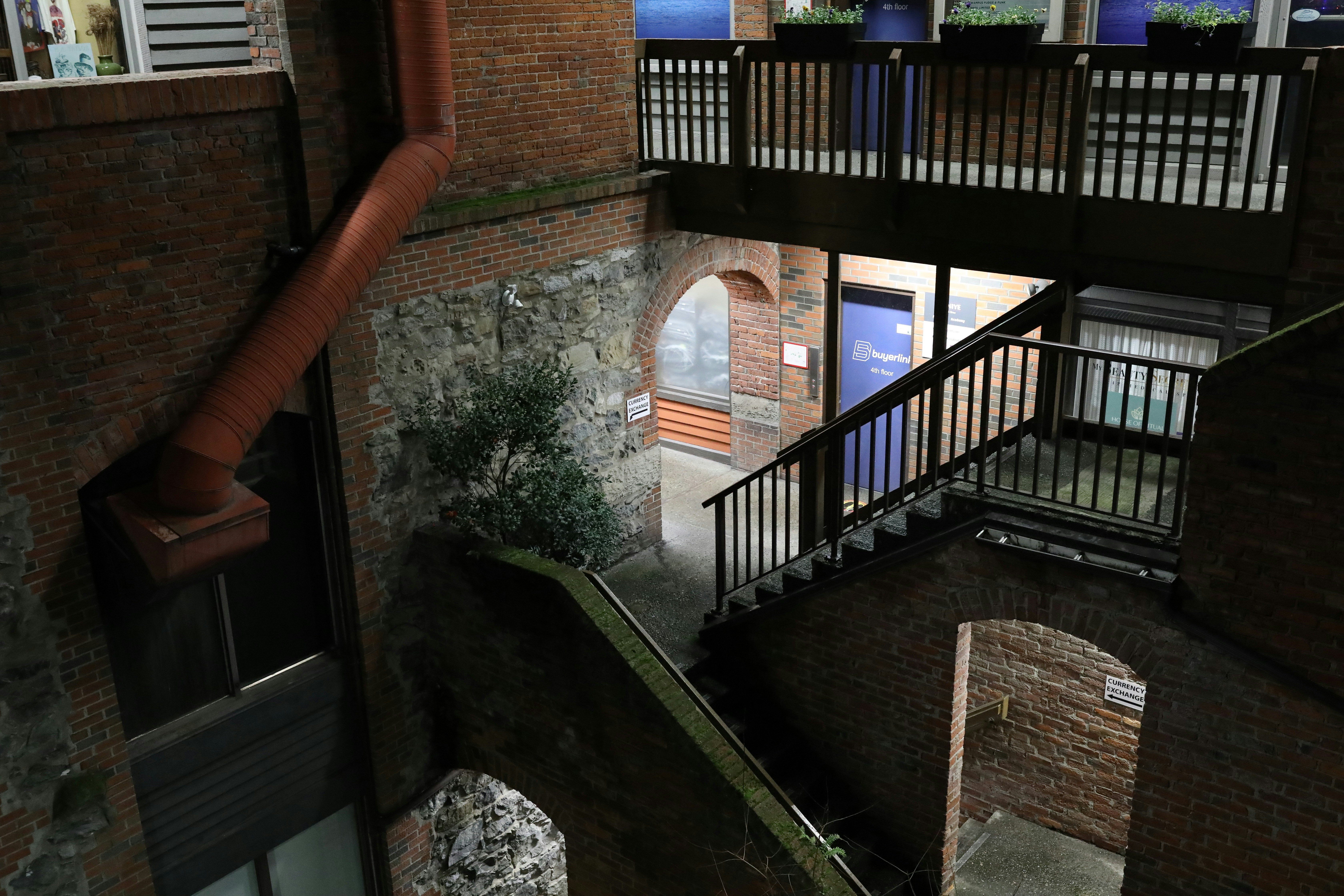 Brick Atrium Echoes: Staircase Vistas in a Quiet Courtyard