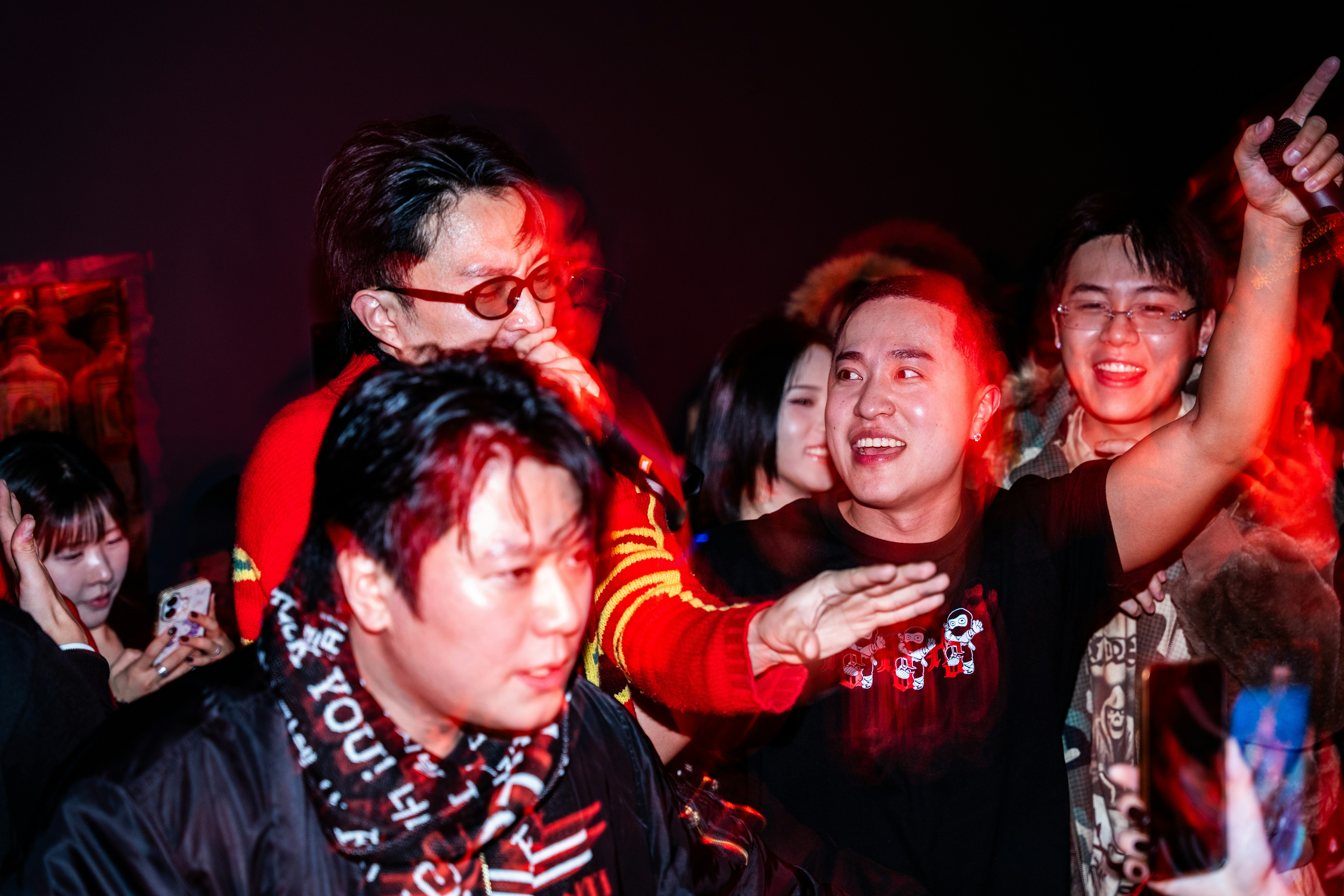 Crowd Surf of Neon Faces: A Night of Shared Cheers