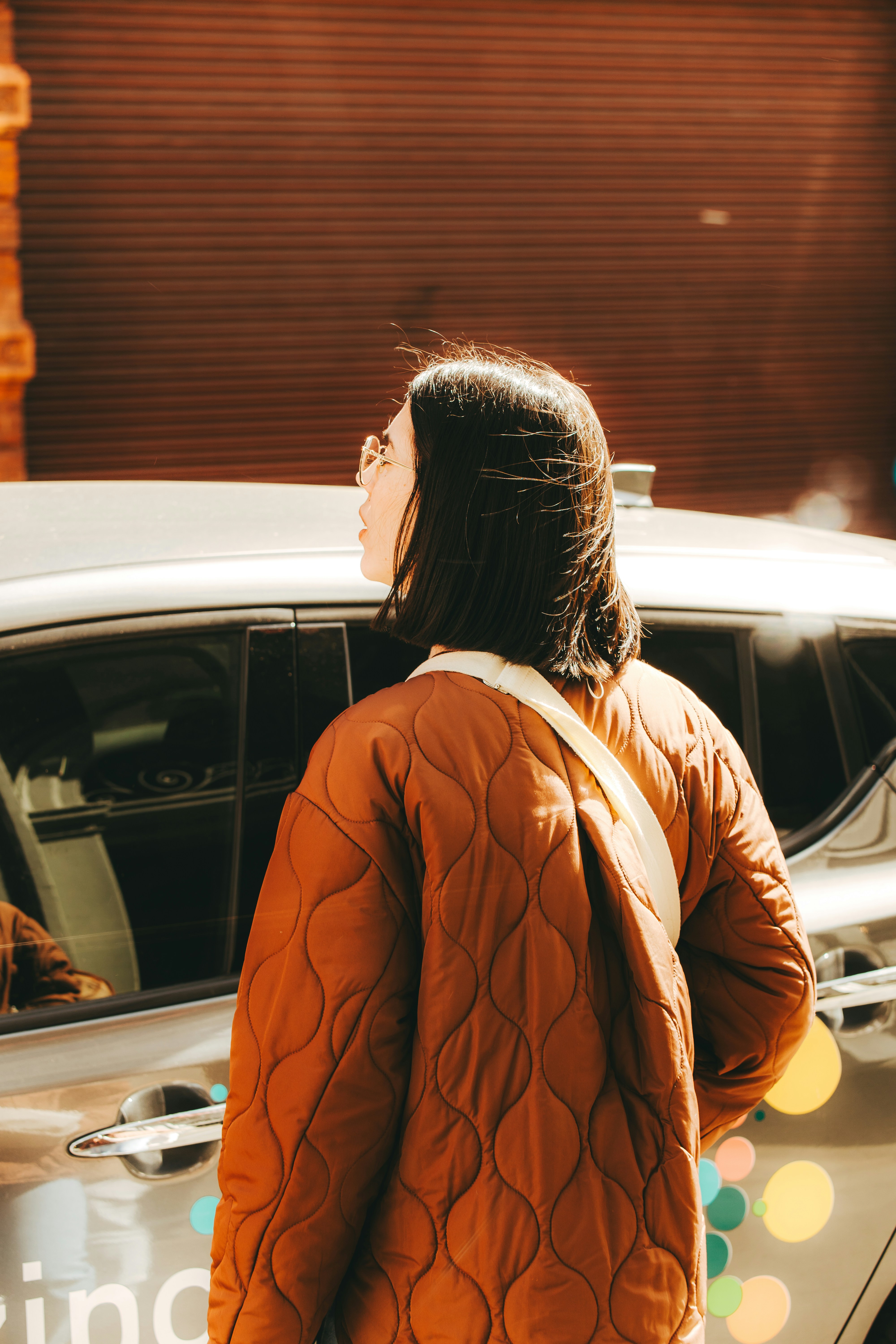Urban Portrait: A Woman in a Car-Side Moment