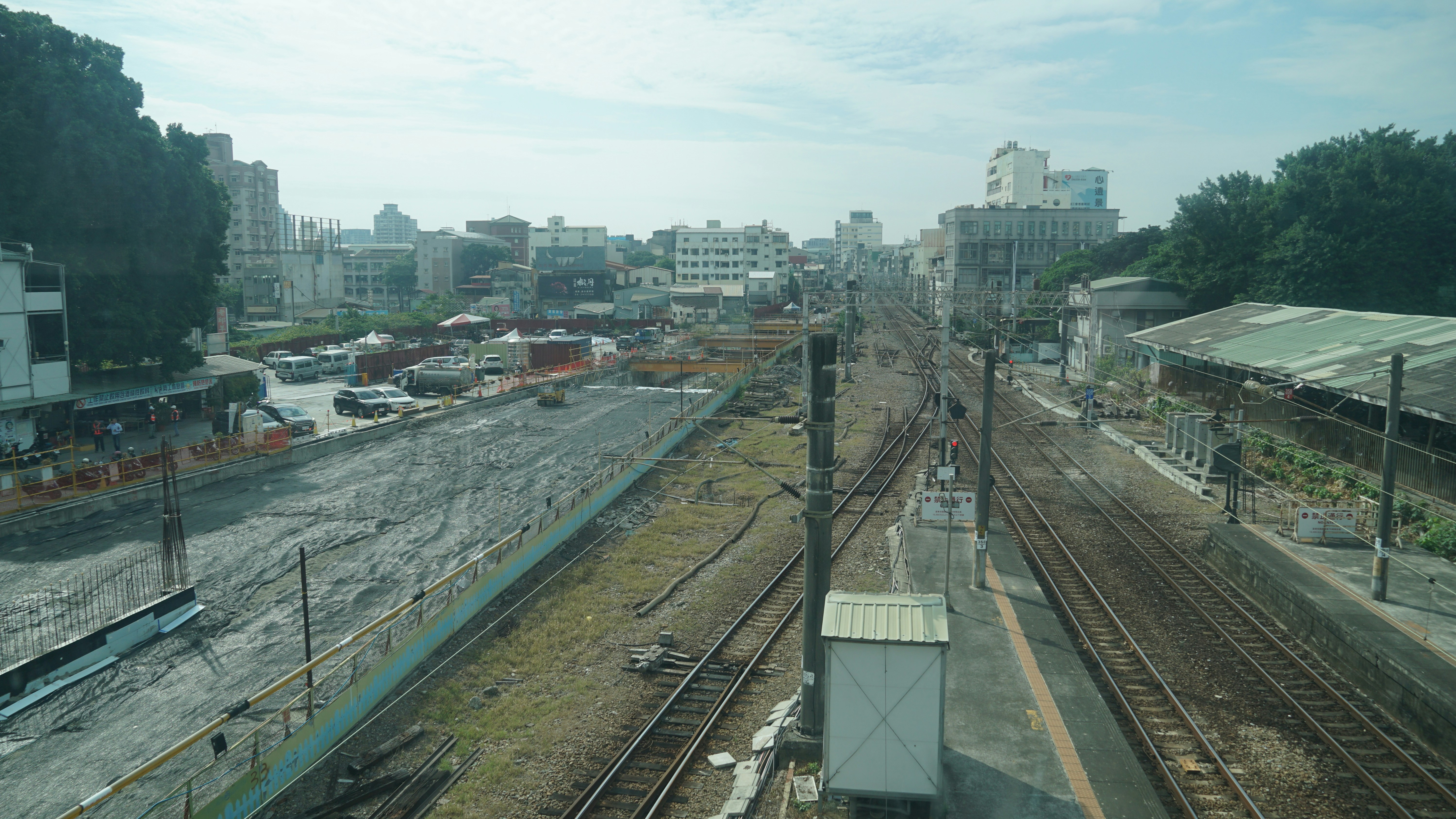 Railway Corridor Through a Busy Urban Landscape at Noon