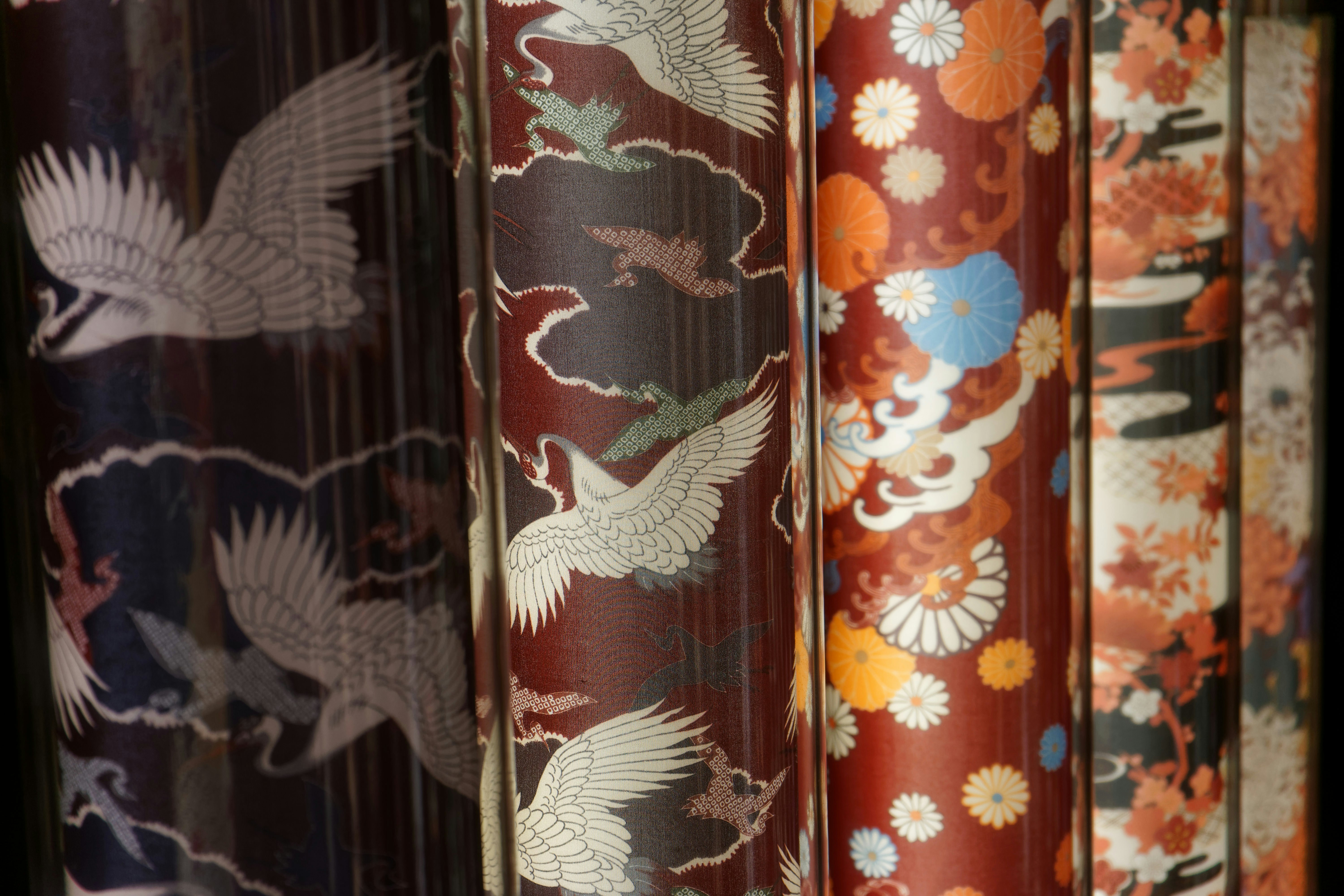 Ornate Crane Motif: A Row of Decorative Textile Scrolls