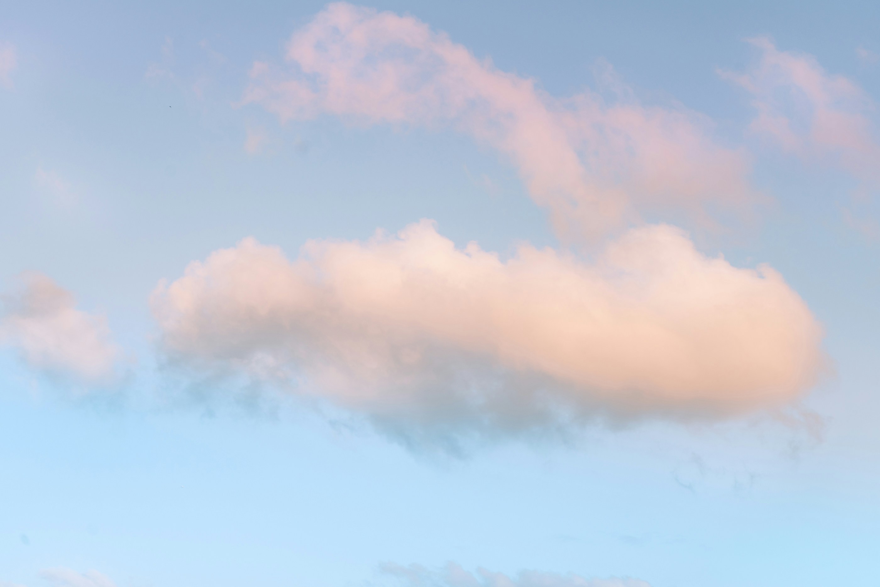 Soft pink clouds drift across a pale blue sky. photo – Free Cloud Image ...