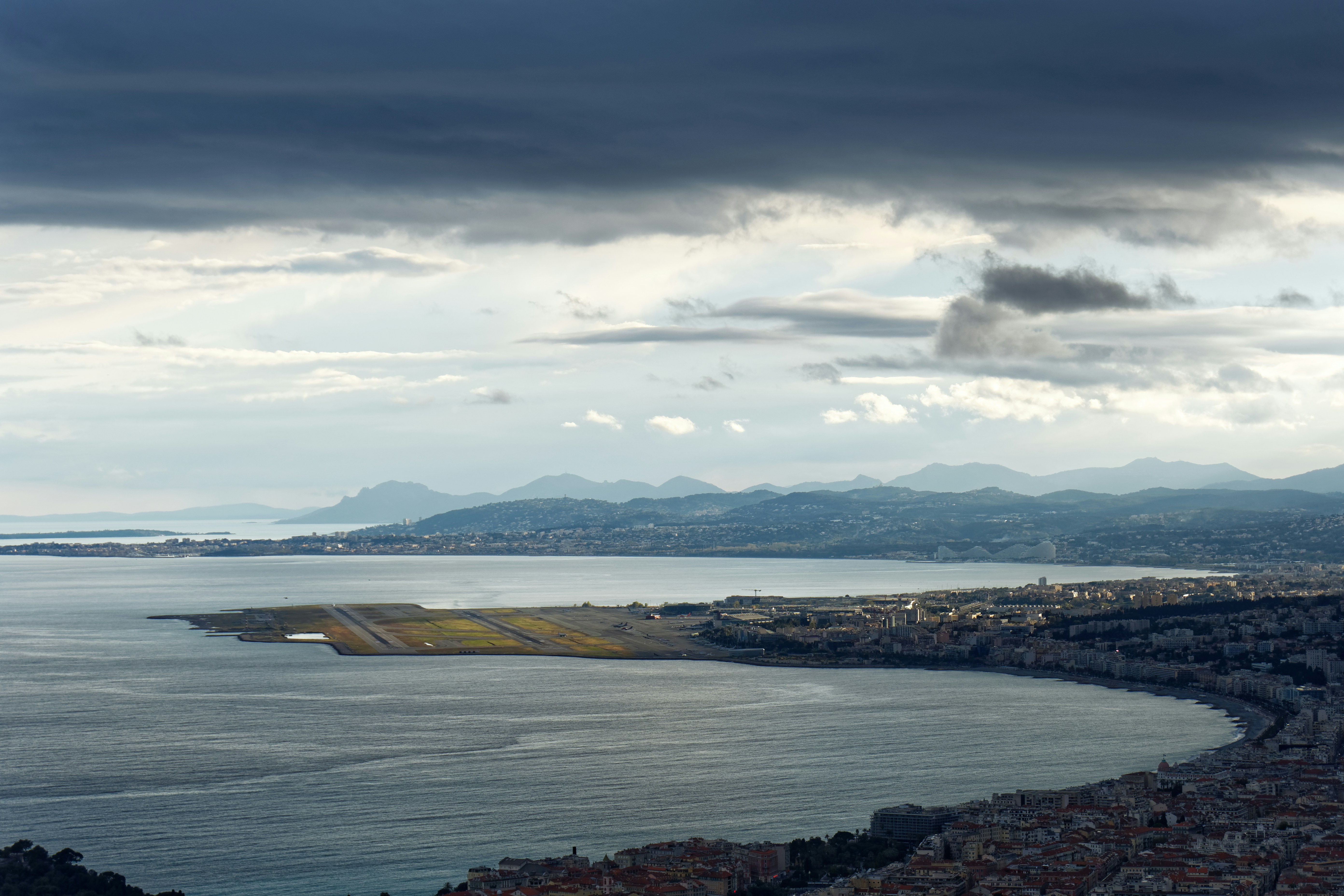 Coastal Panorama: Distant Hills Guarded by a Quiet Sea
