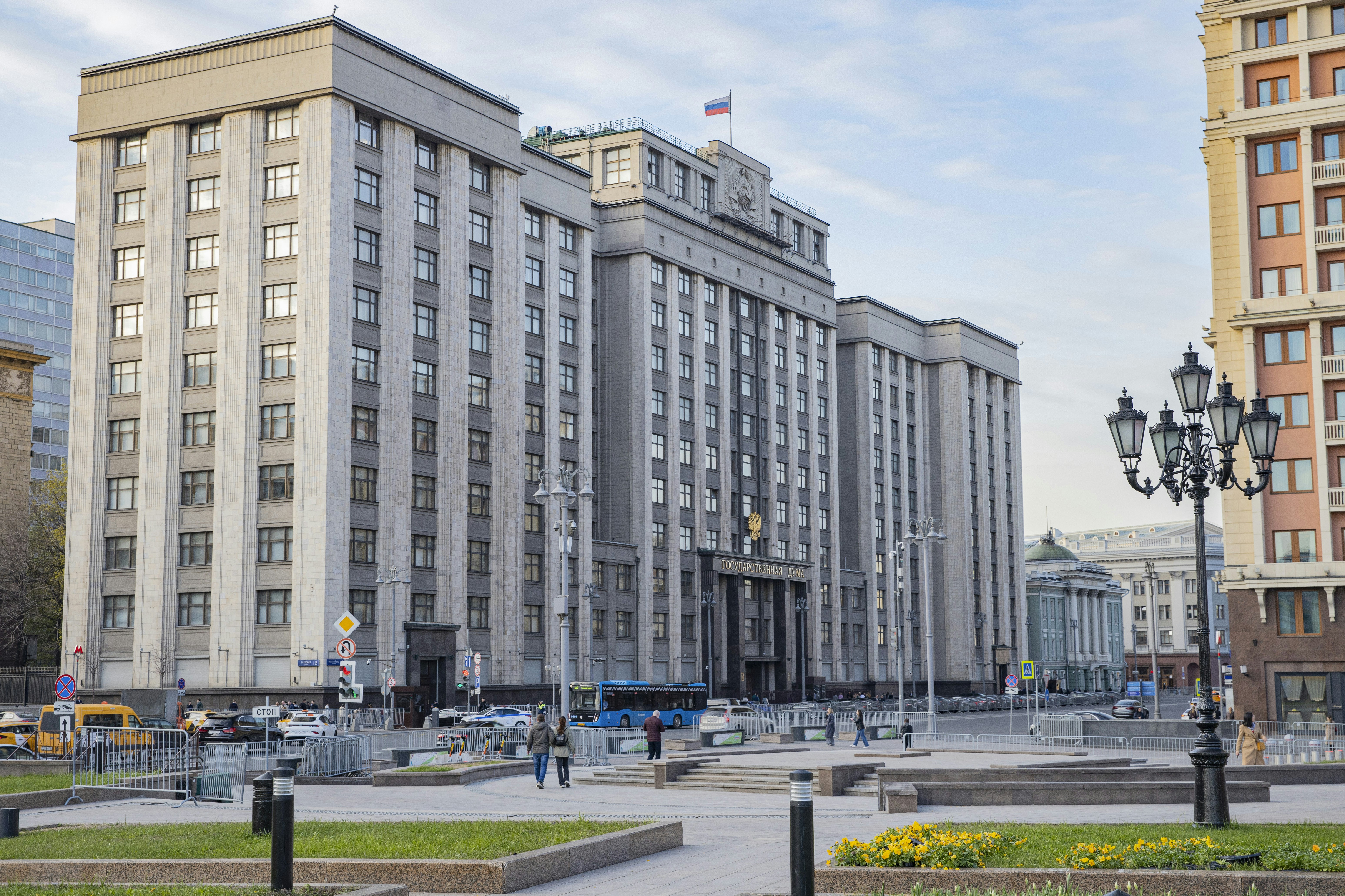 Symmetrical City Hall Shielded by Flagpole Rows