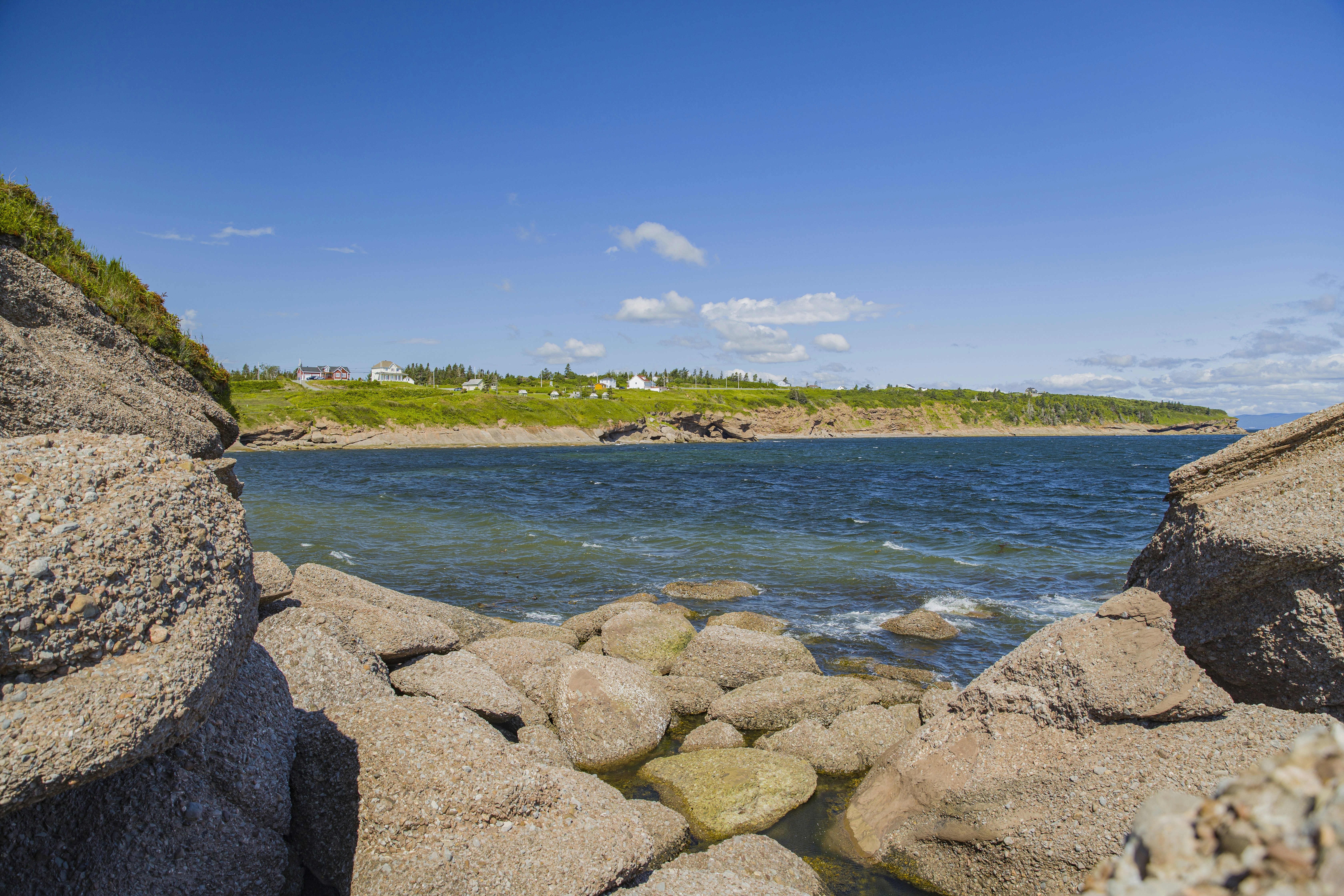 Rugged Seaside Portal: Rocks Framing a Quiet Coastal Scene