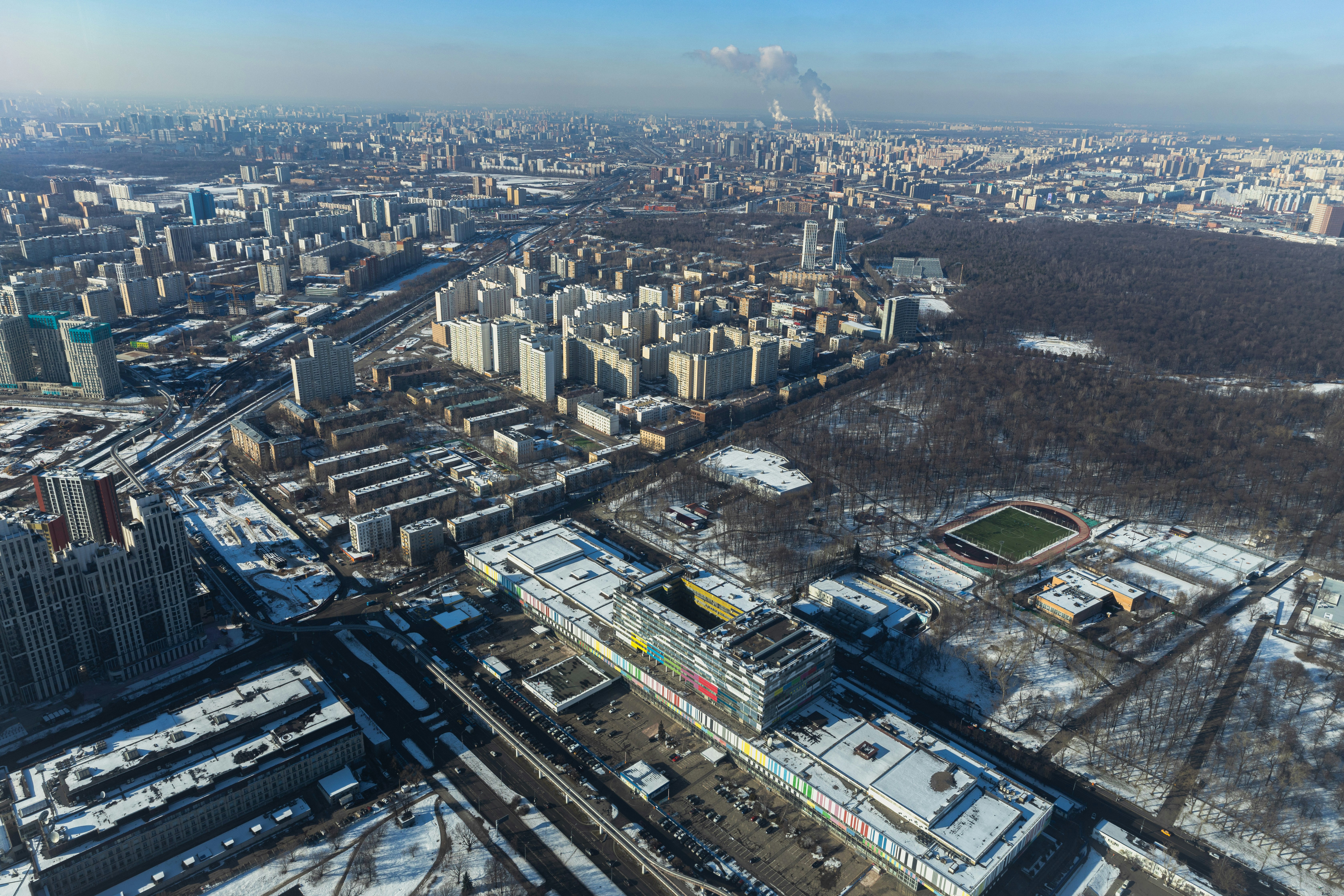 Snow-lit Campus Spine: Aerial View Over a Winter Cityscape