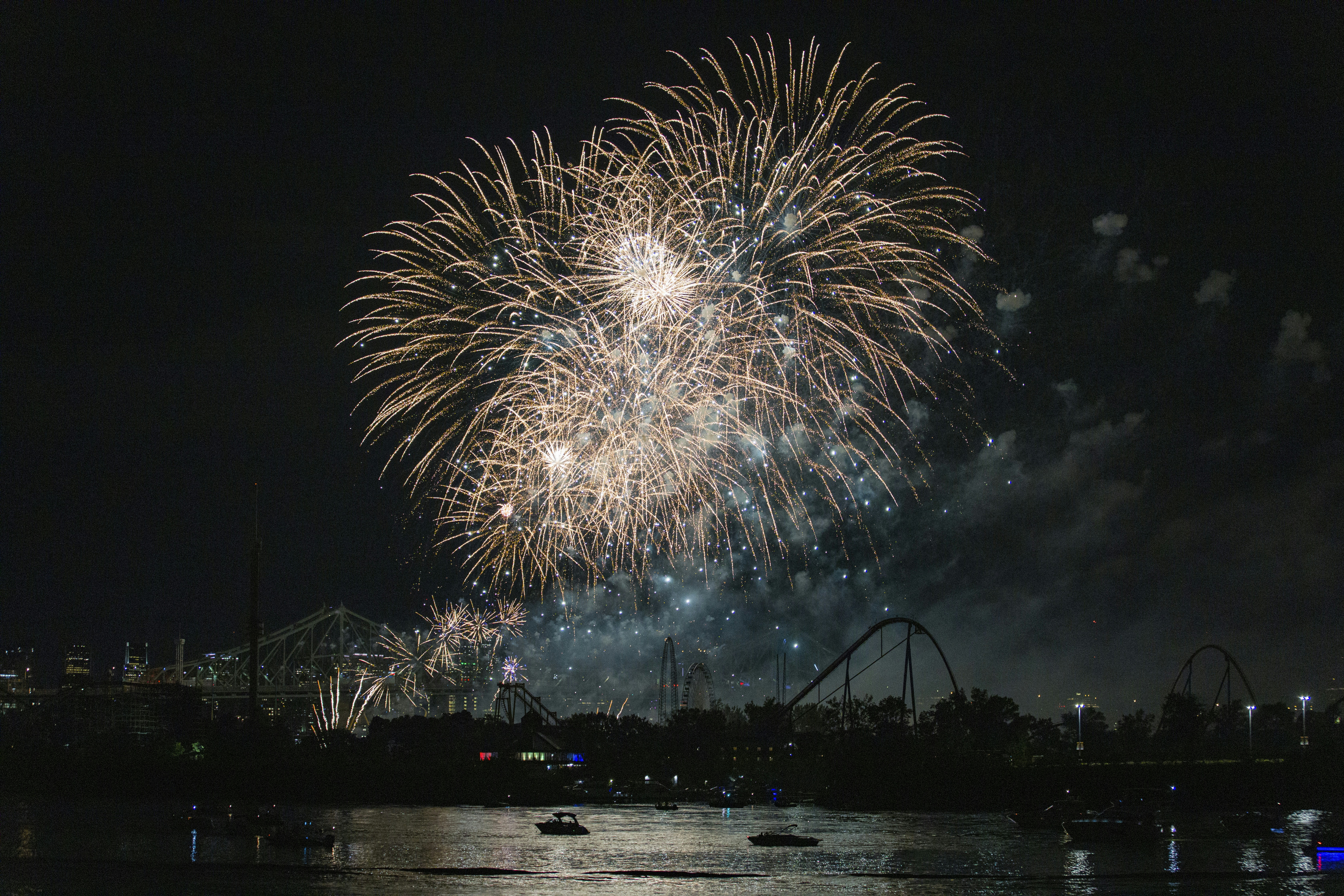 Midnight Burst: Fireworks Over a Quiet City River
