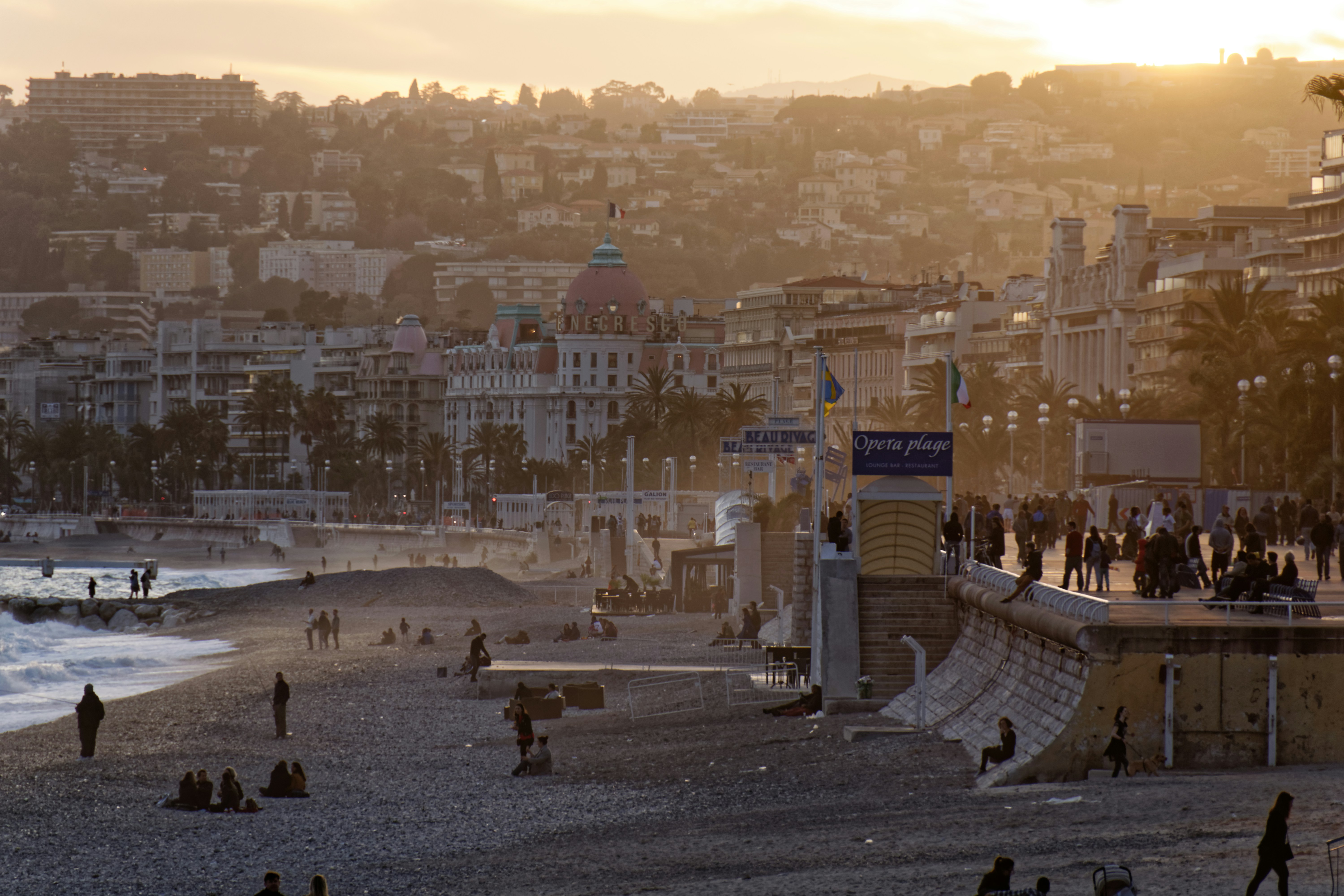 Golden Hour Promenade: A City Beach at Dusk