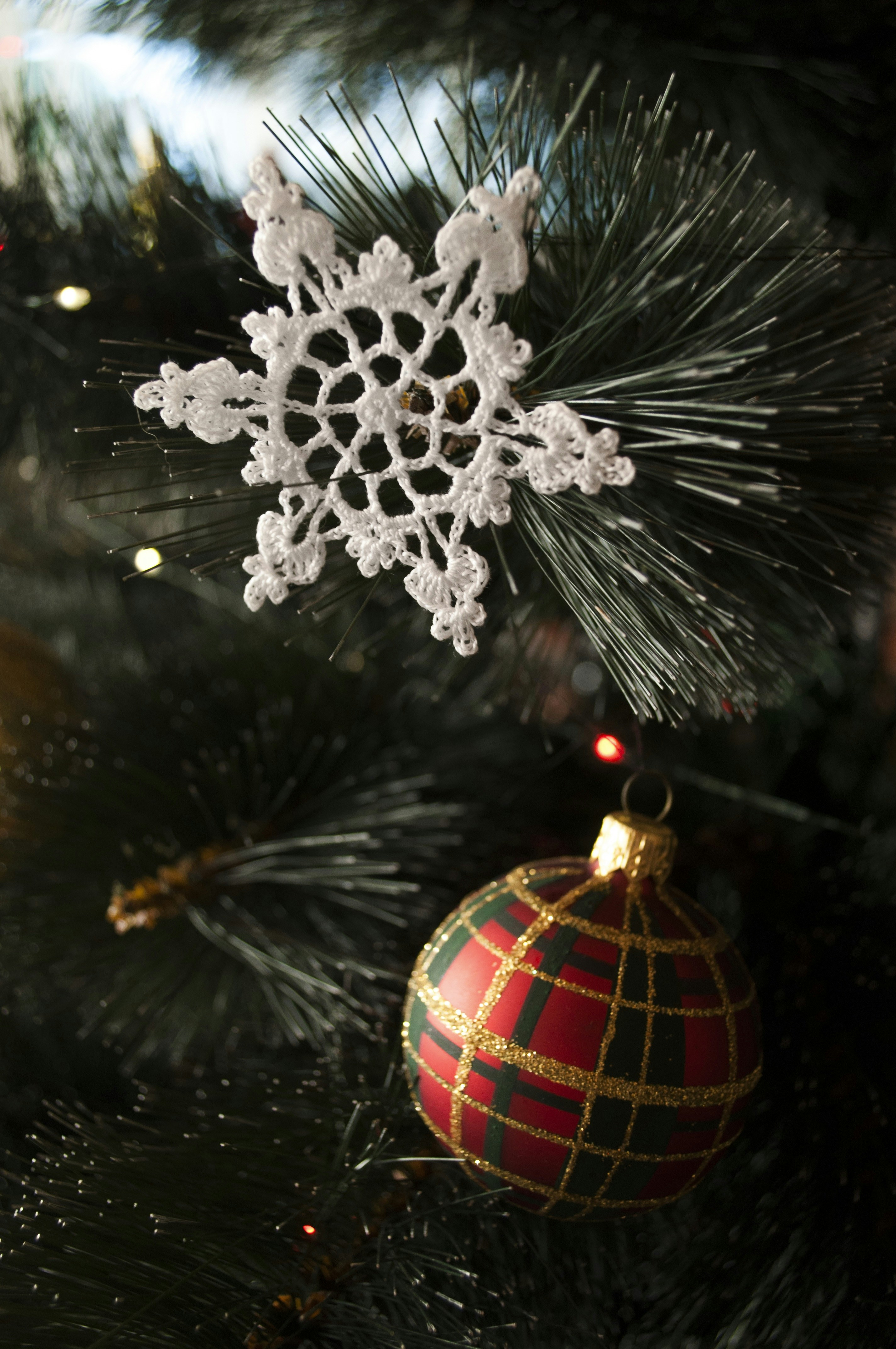 Snowflake Crown: A Frosted Snowflake Gravitating Above a Christmas Ornament