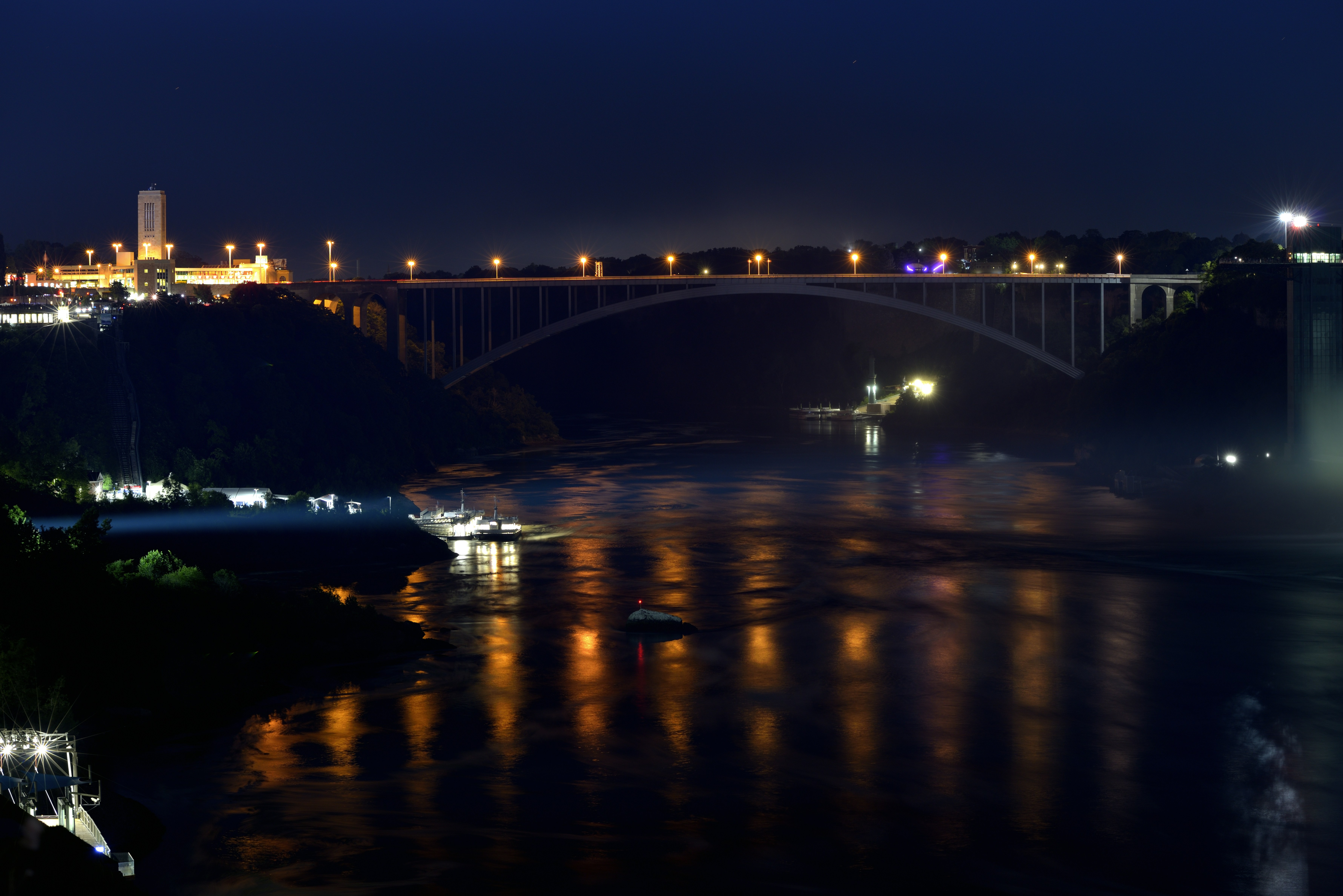 Night River Arc: Lights on the Water beneath the Silent Bridge