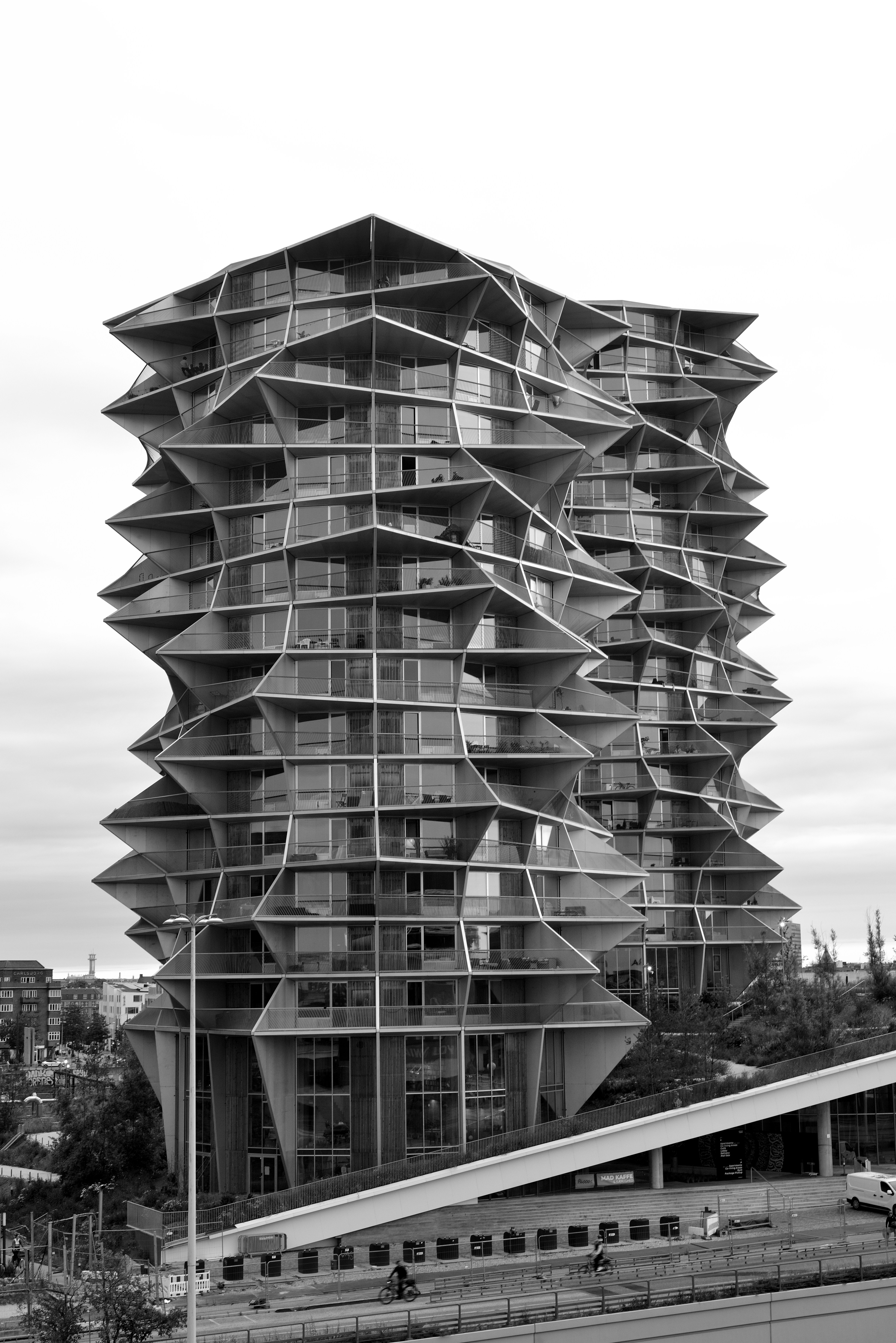 Chevronal Facades: A Tower of Geometric Echoes