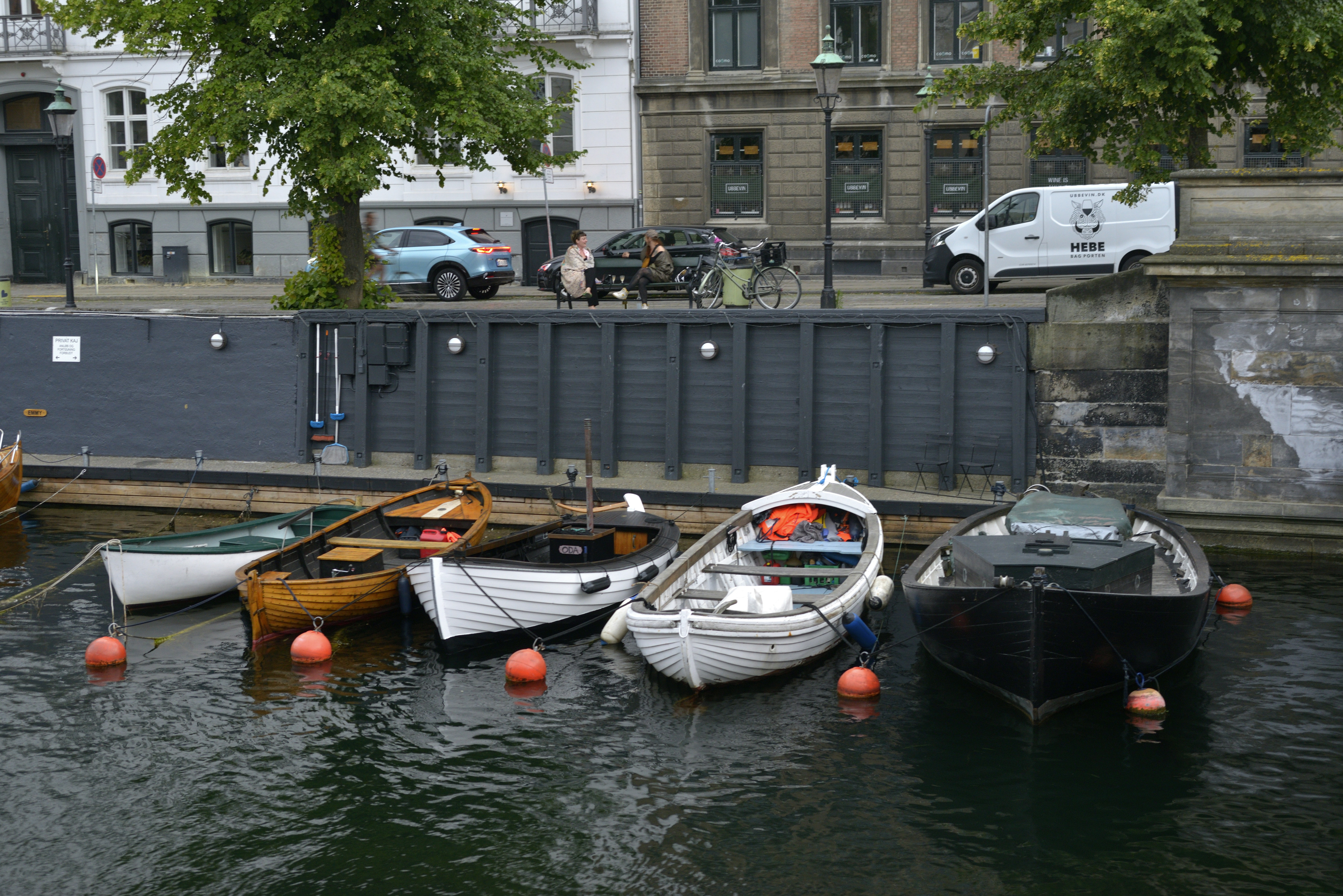 Row of Boats Floating Along a Tranquil Canal