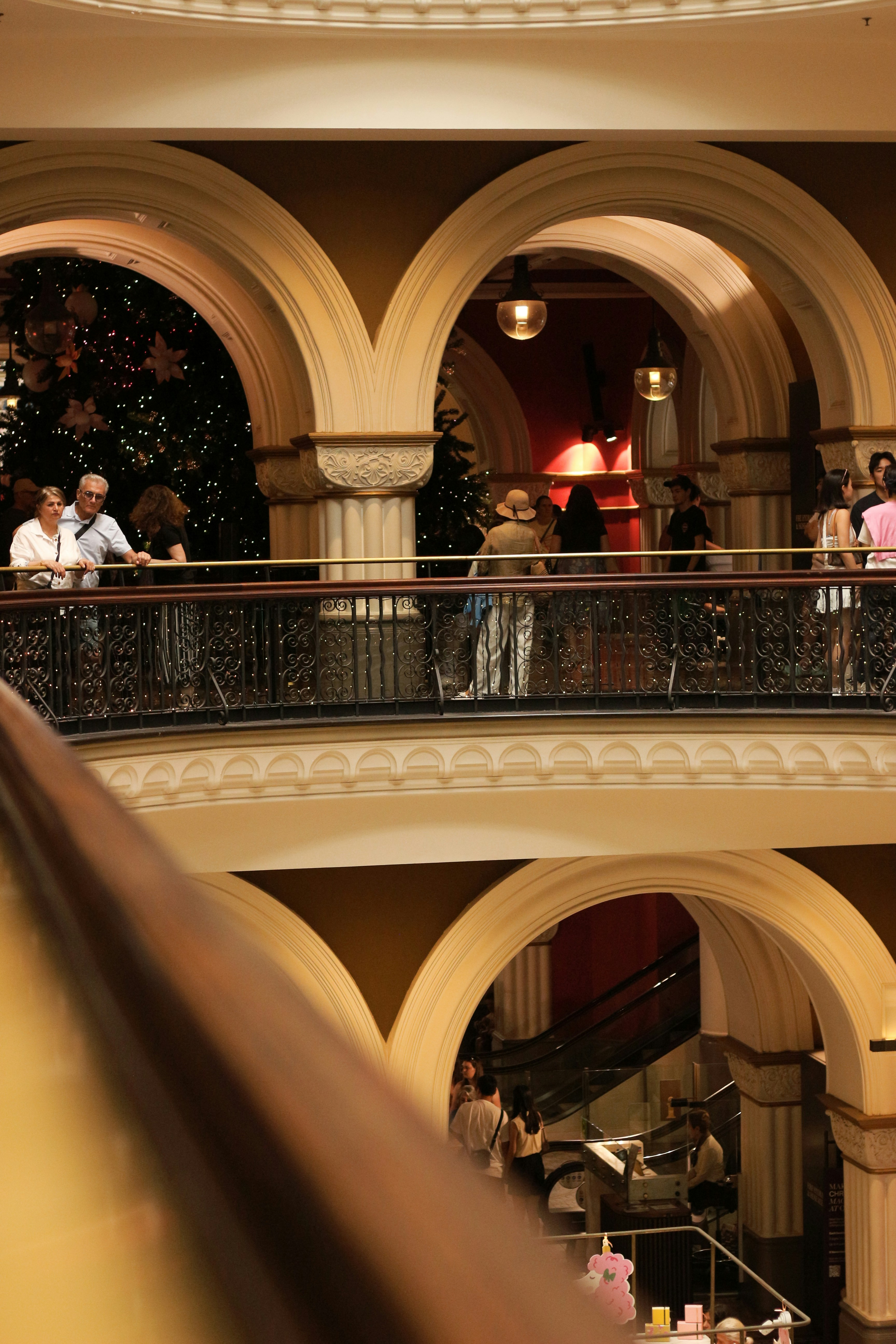 Archway Gallery: Balcony silhouettes under warm glow