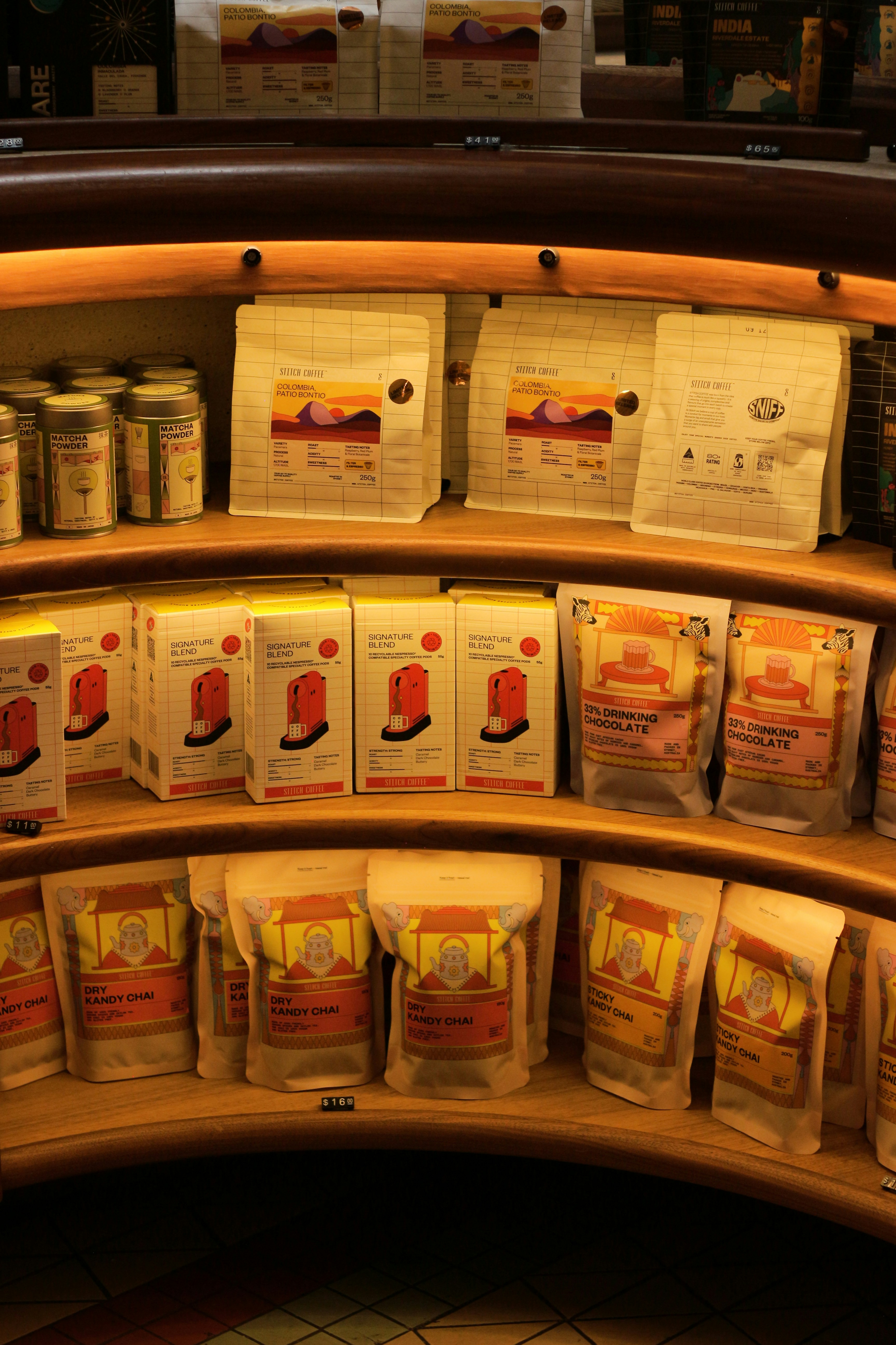 Shelves of Specialty Brews: A Warm Palette of Tea and Coffee 'Pouches'