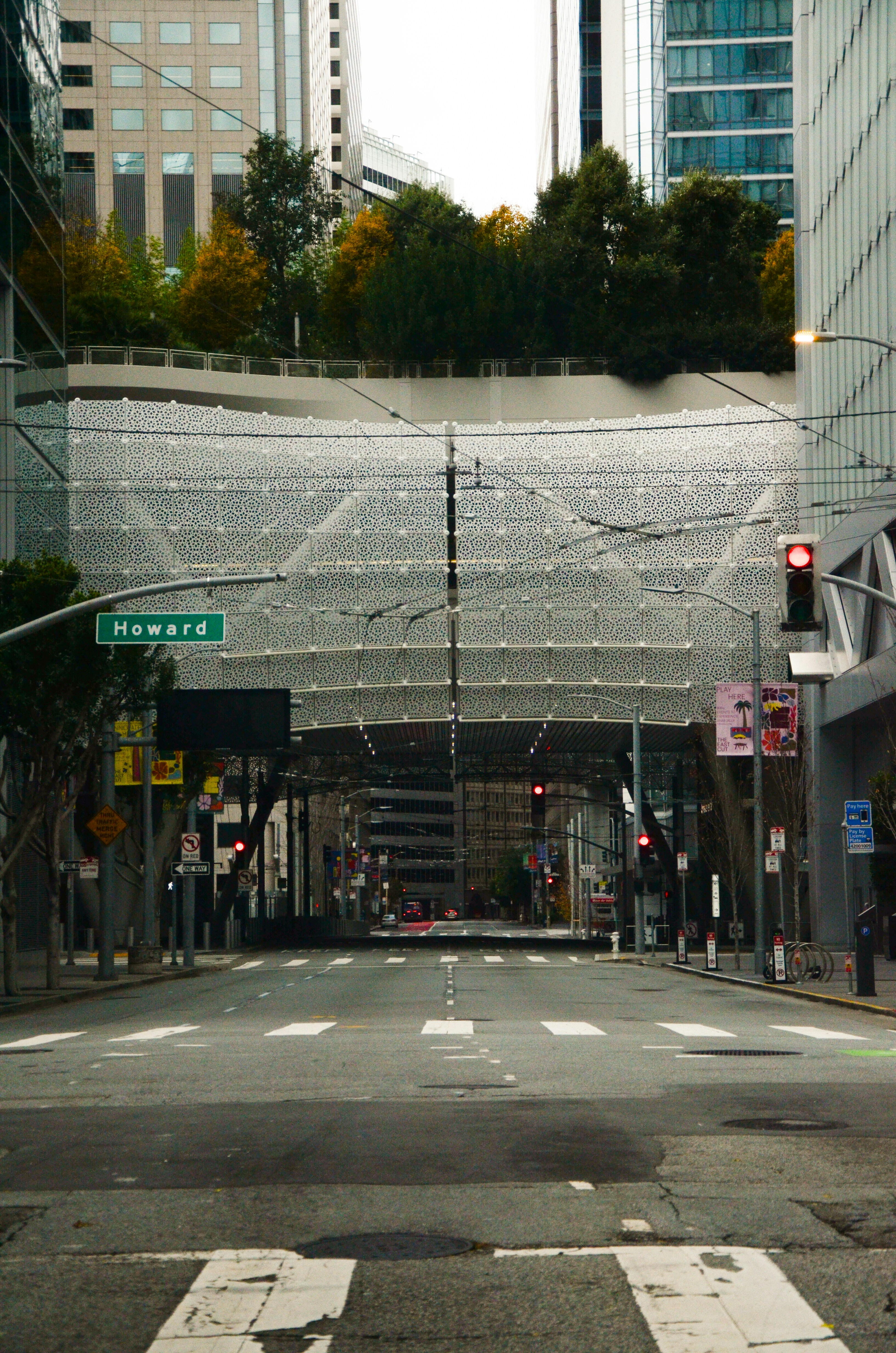Urban Archway: Street Canyon Beneath a Patterned Pier