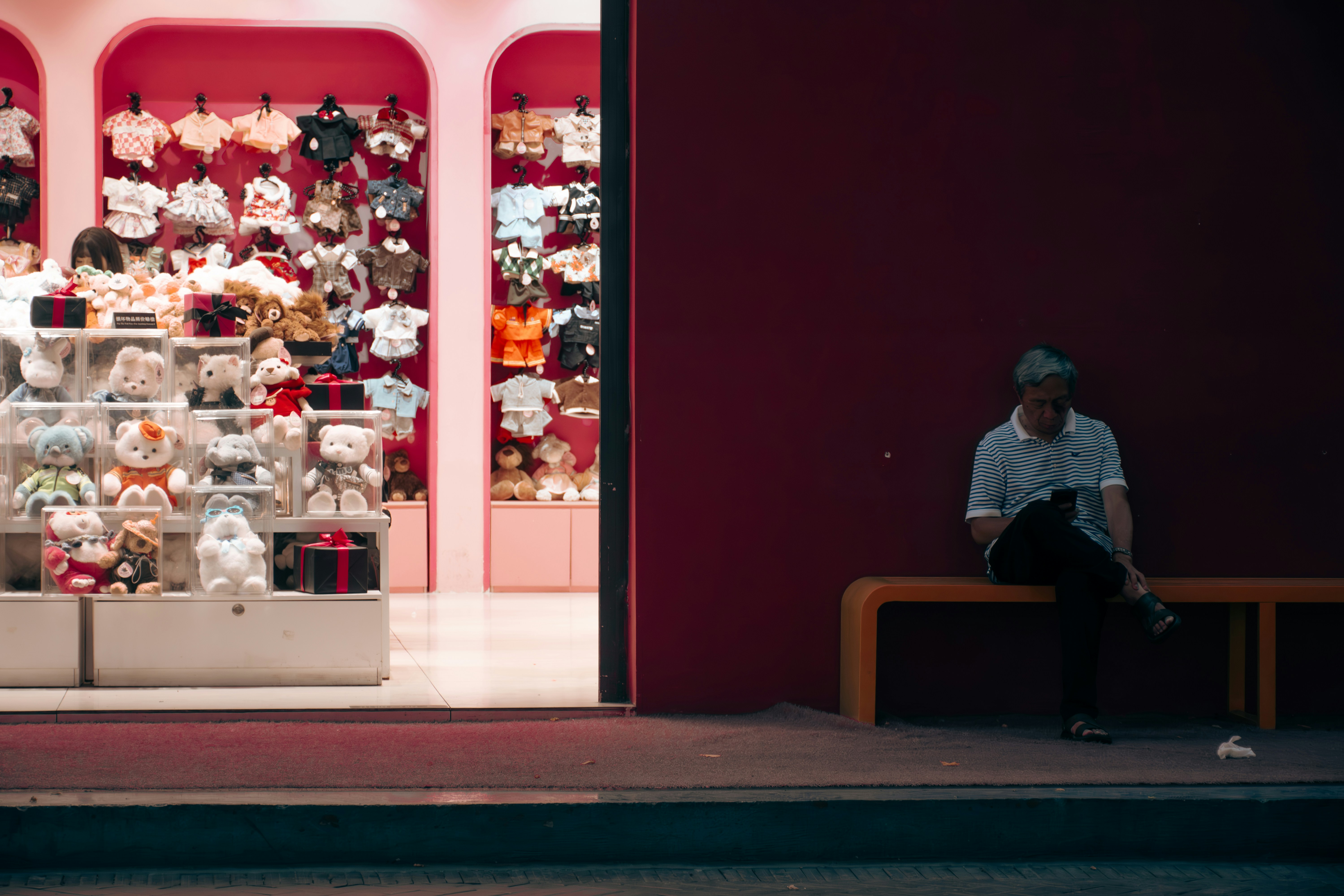 Neon Toy Shop Window Meets Quiet Street Bench