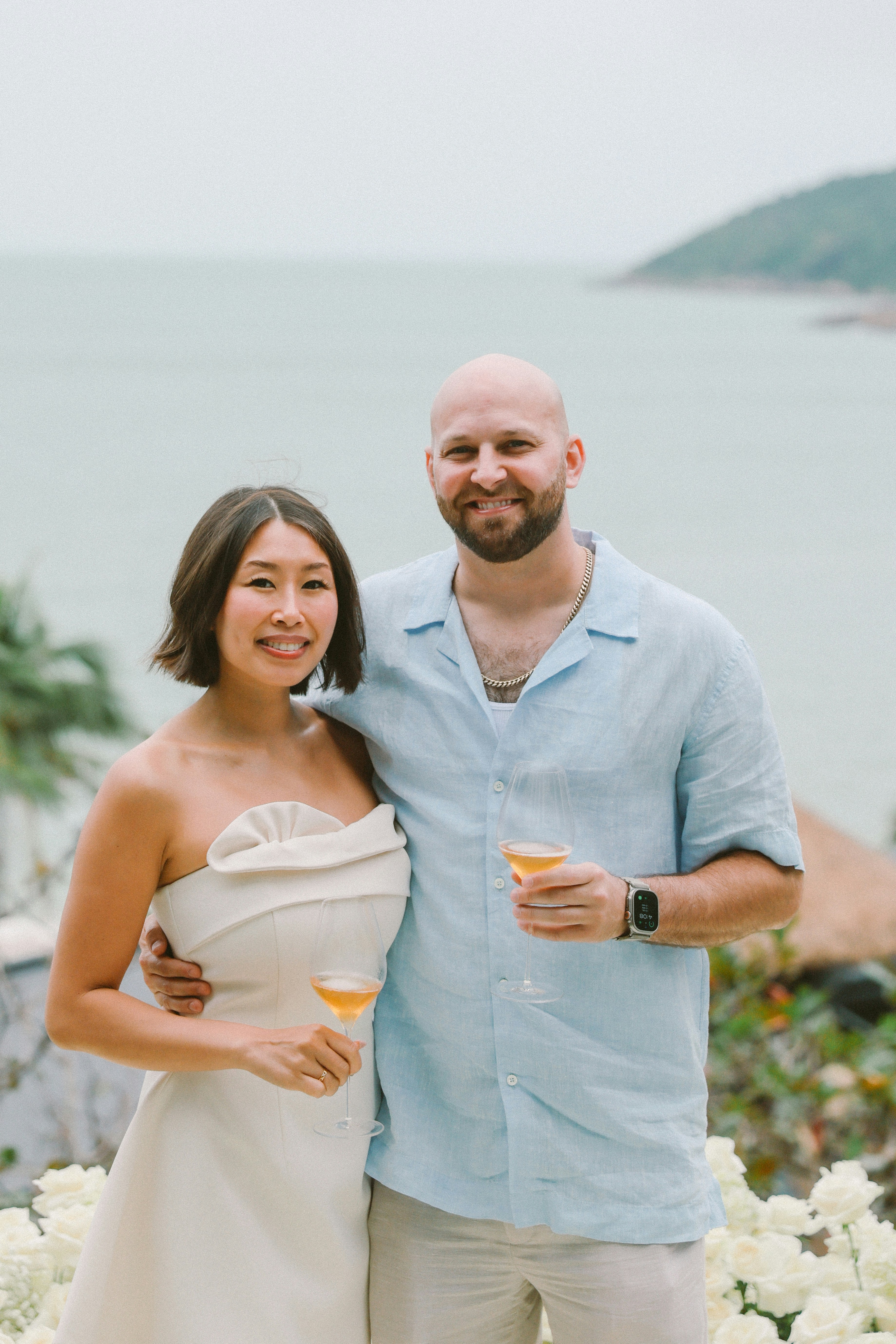  seaside celebration: couple in pastel tones by the shore