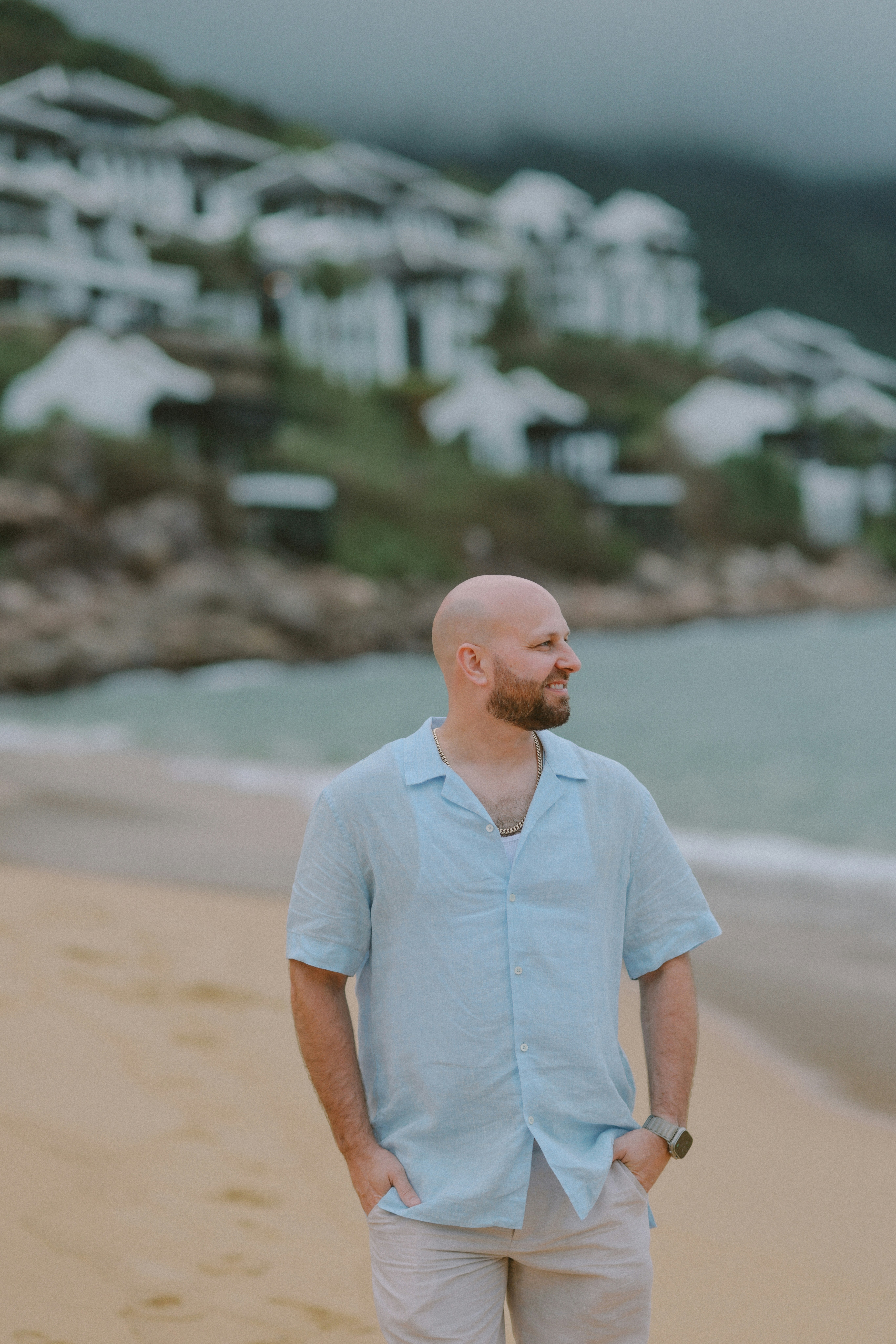 Coastal stroll: a calm portrait against a hillside resort