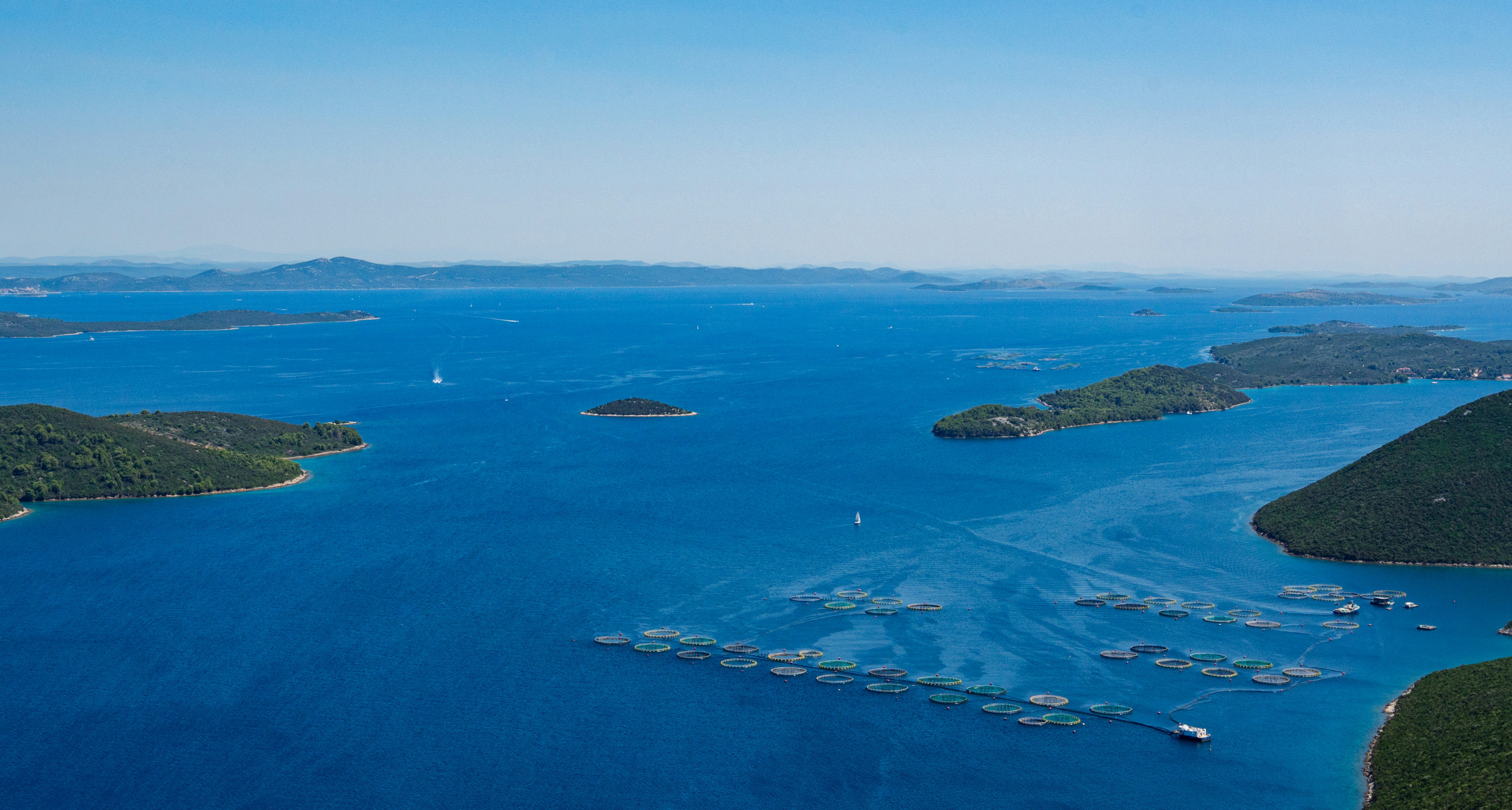 Azure Archipelago: Aerial View Across Quiet Currents