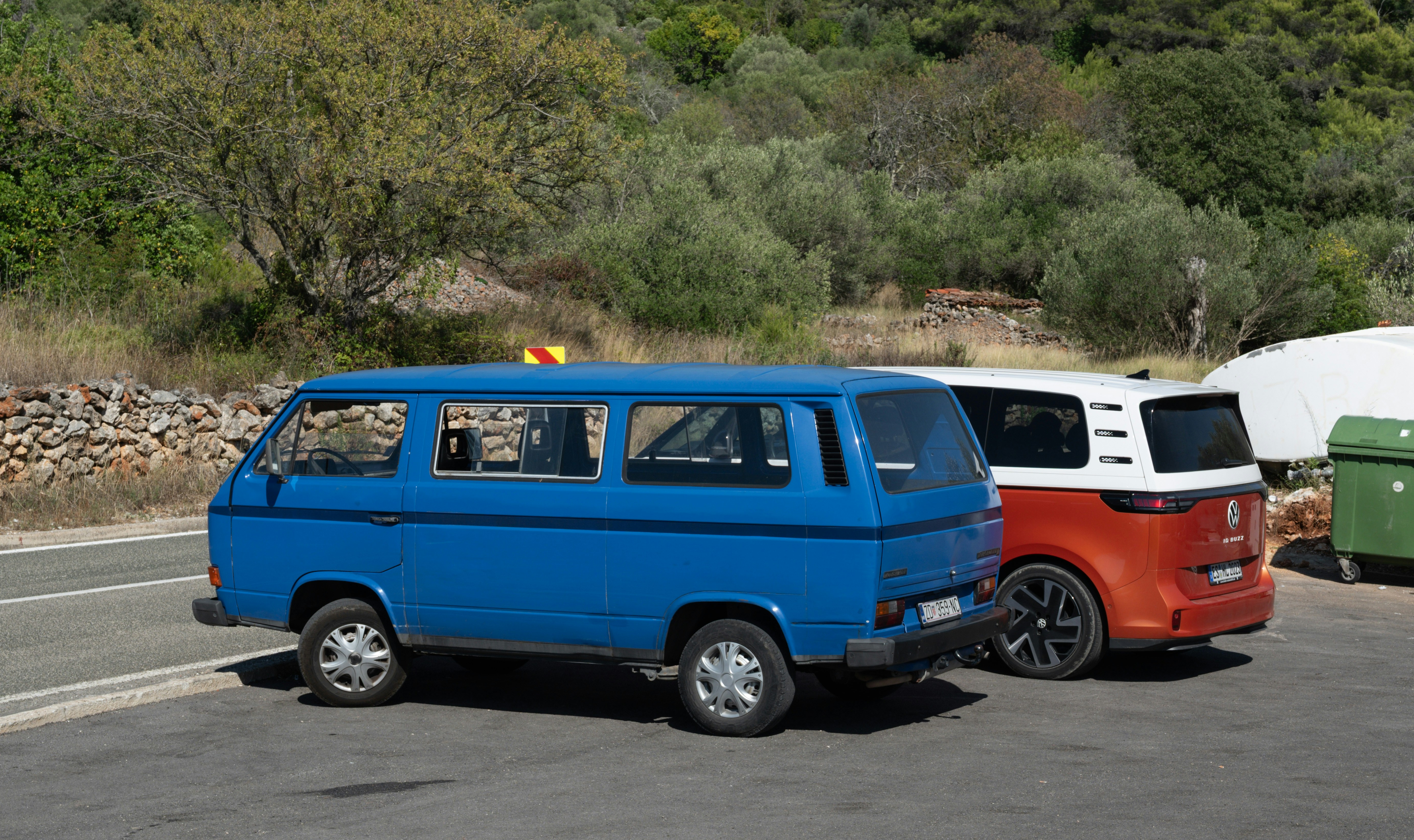 Blue Van Duo: A Quiet Parking Lot Snapshot