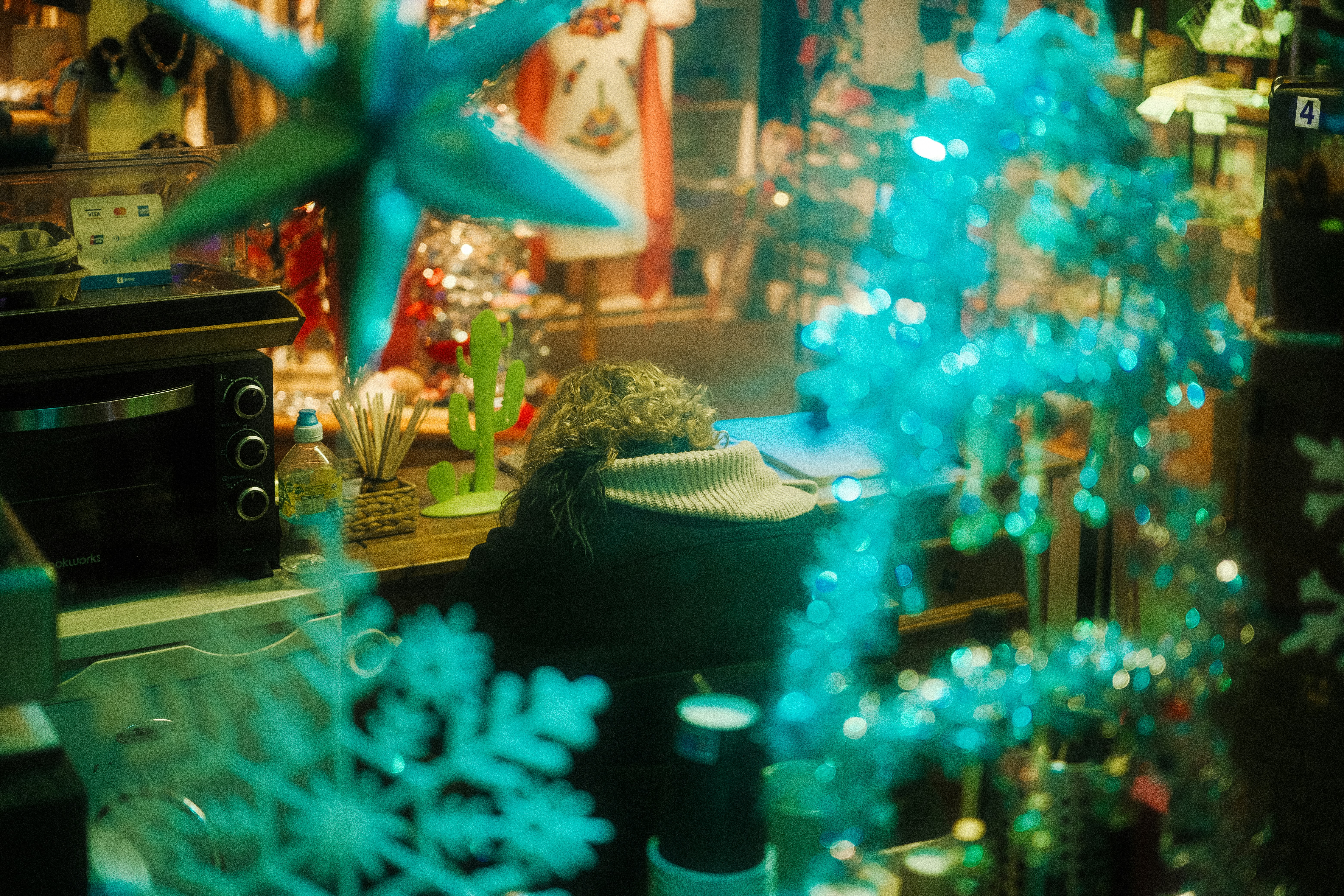 Dreamy Boutique Window: Neon Snowflakes and Quiet Hands