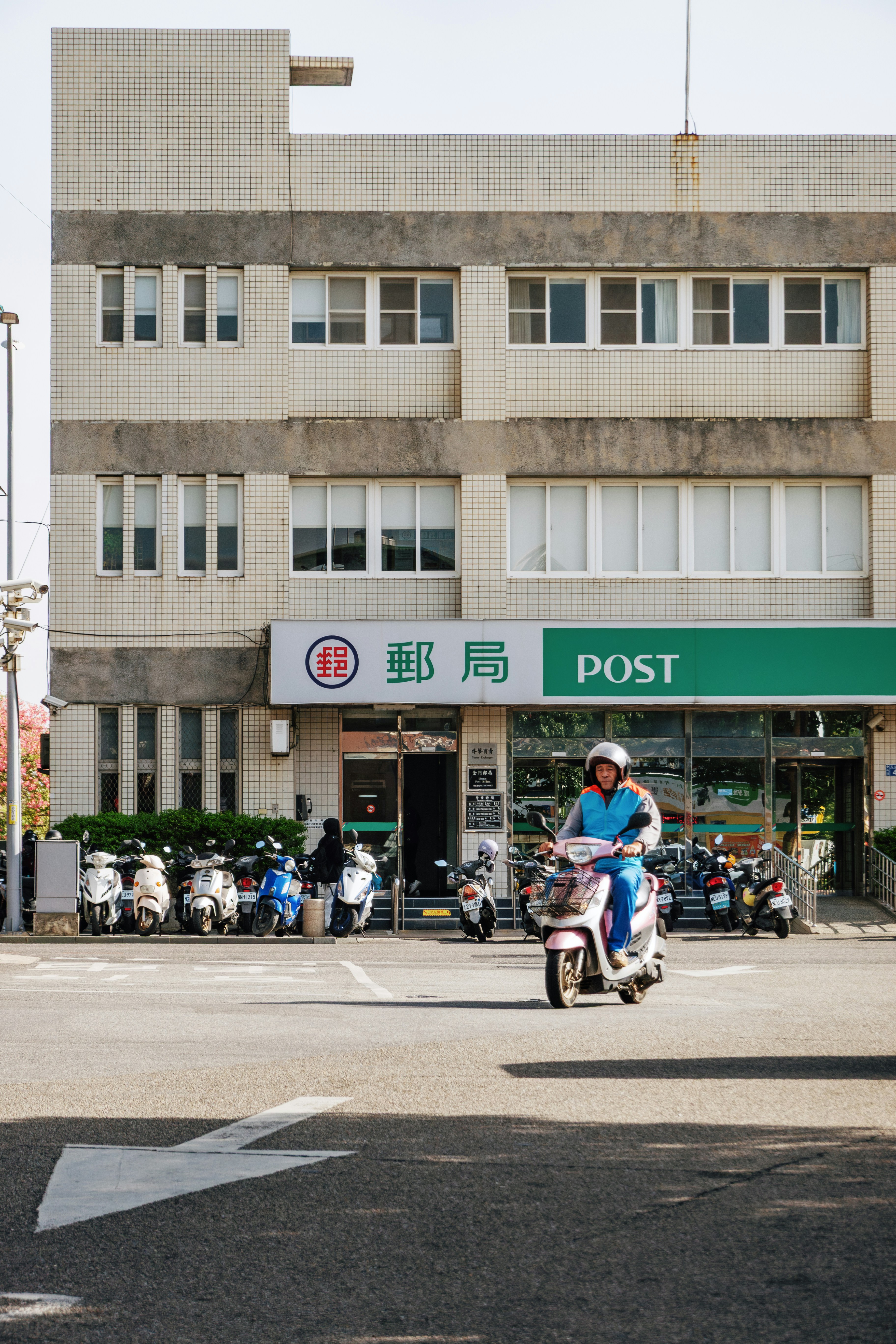 Scooter Rider in Front of a Post Office at Dusk-Tone Street