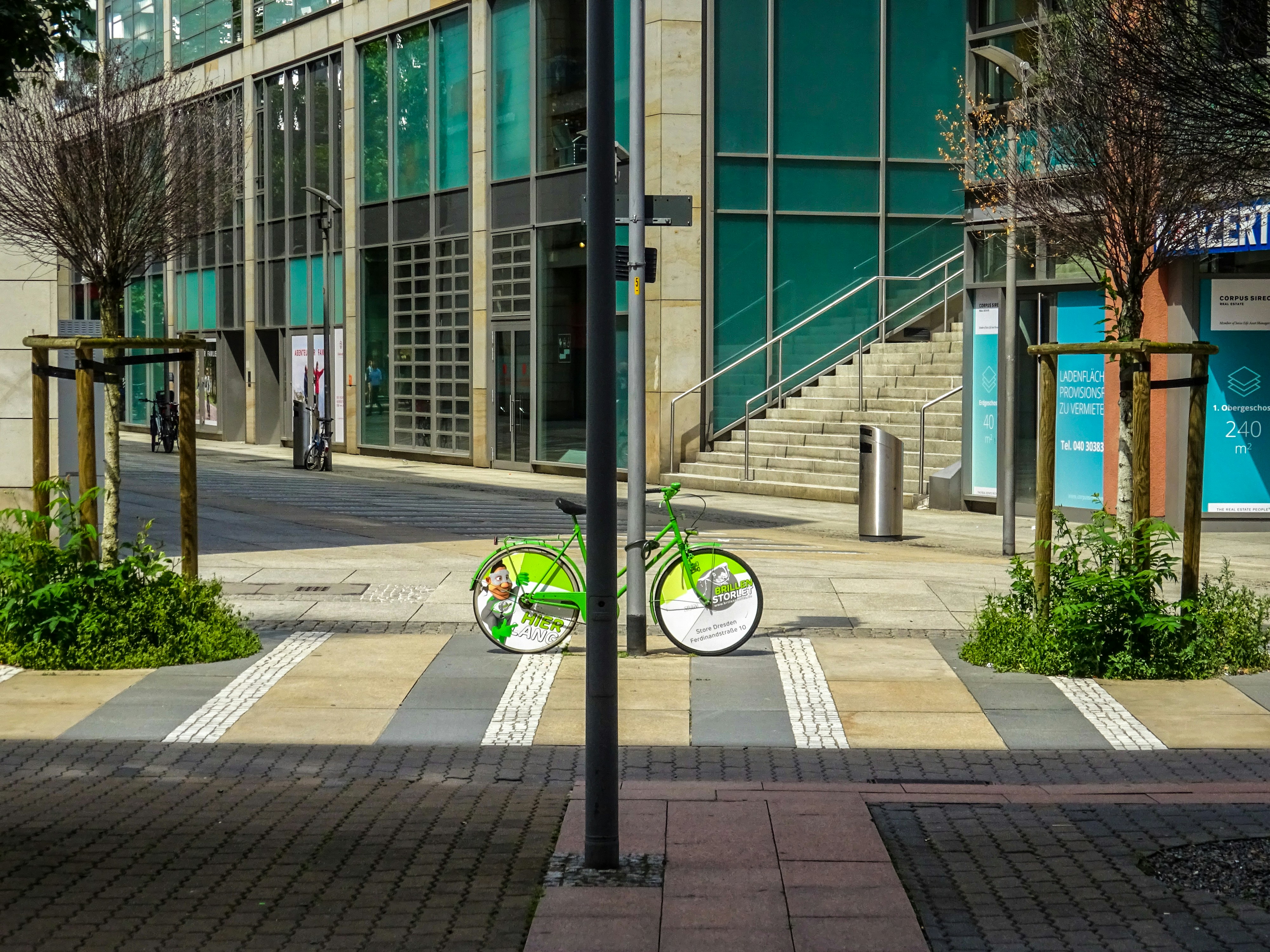 Green rental bikes at the urban plaza